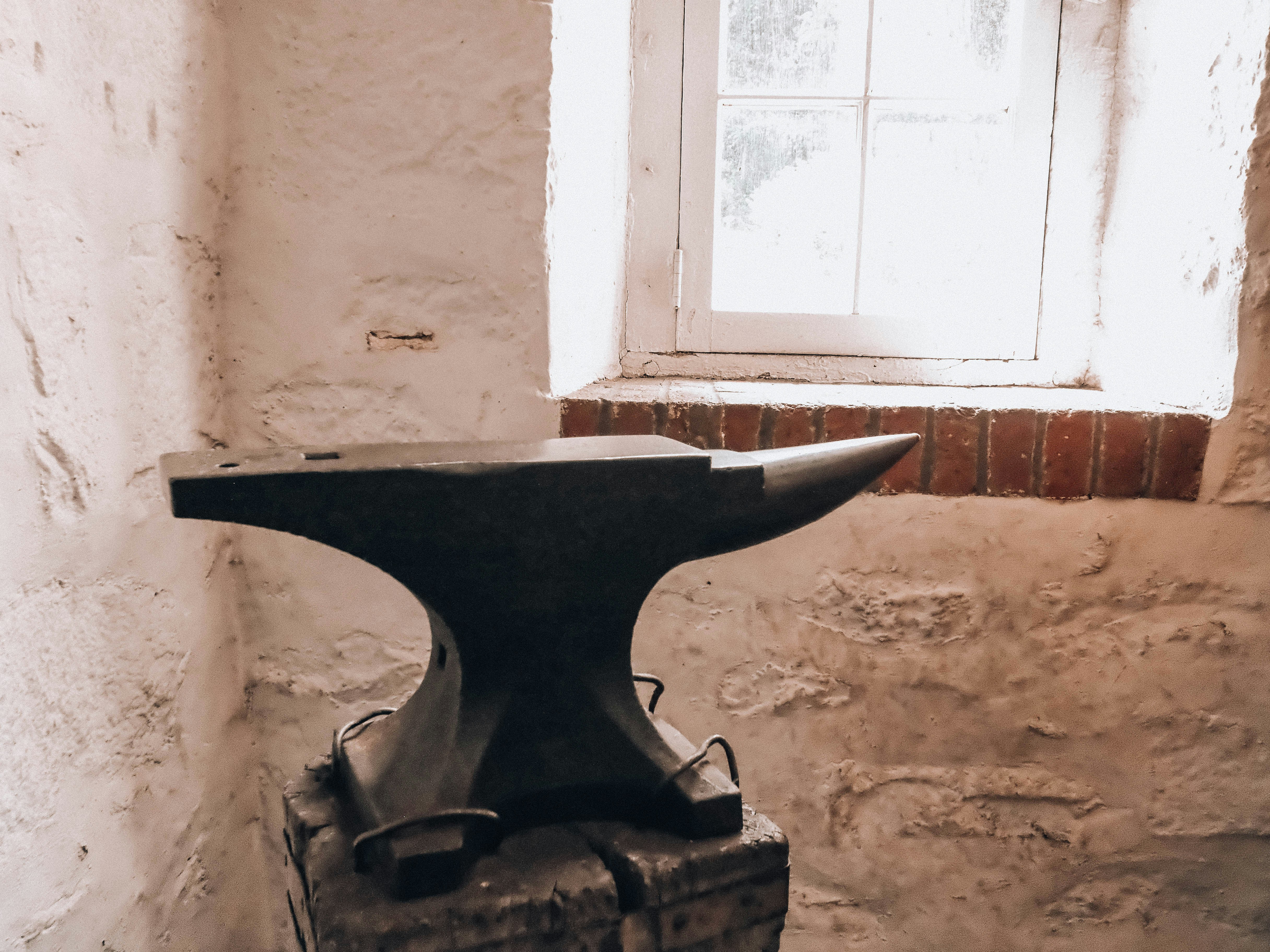 Anvil and Window: Rustic Workshop in Sepia Light