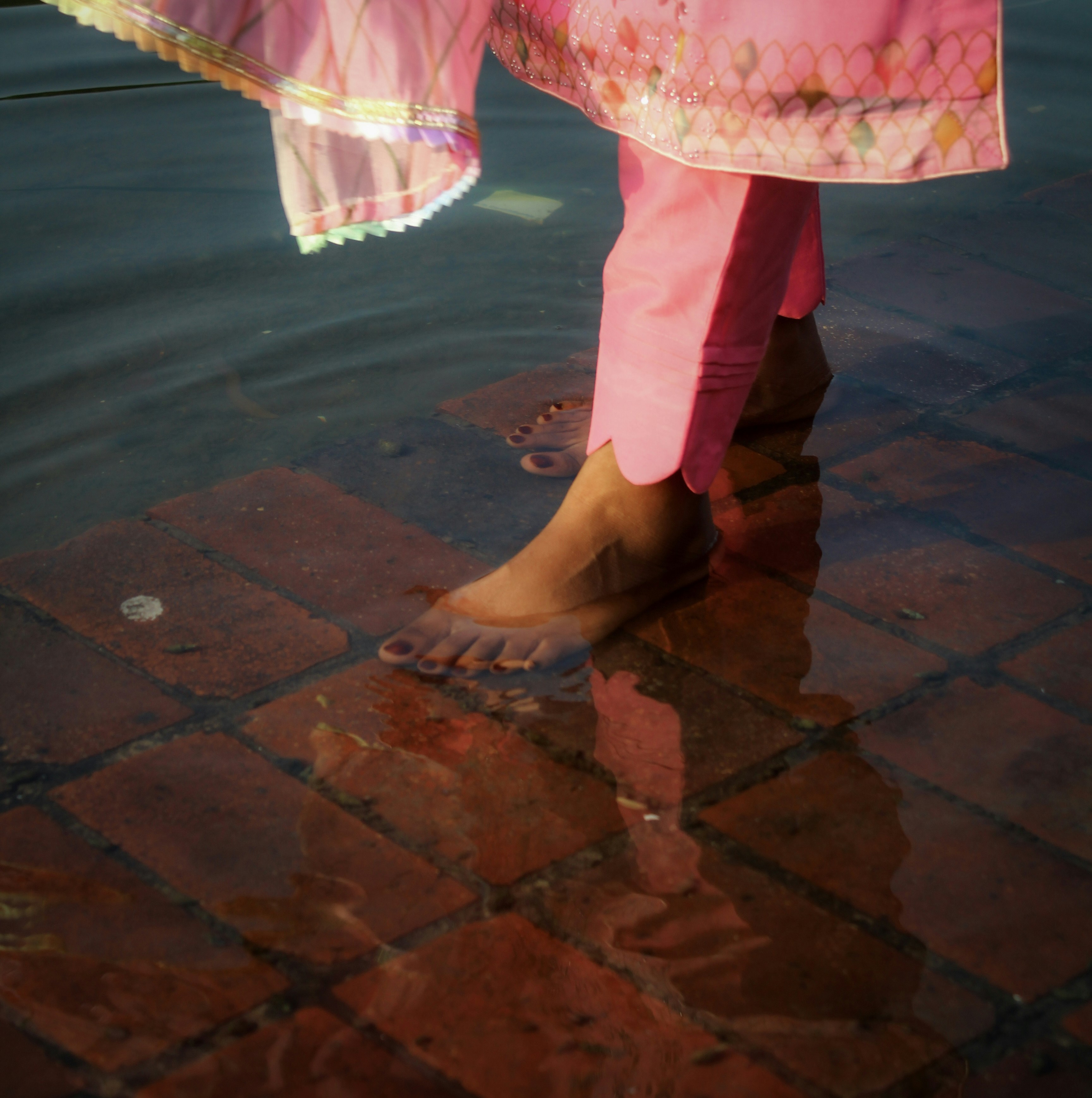 Barefoot Steps on a Rain-Wlicked Brick Path