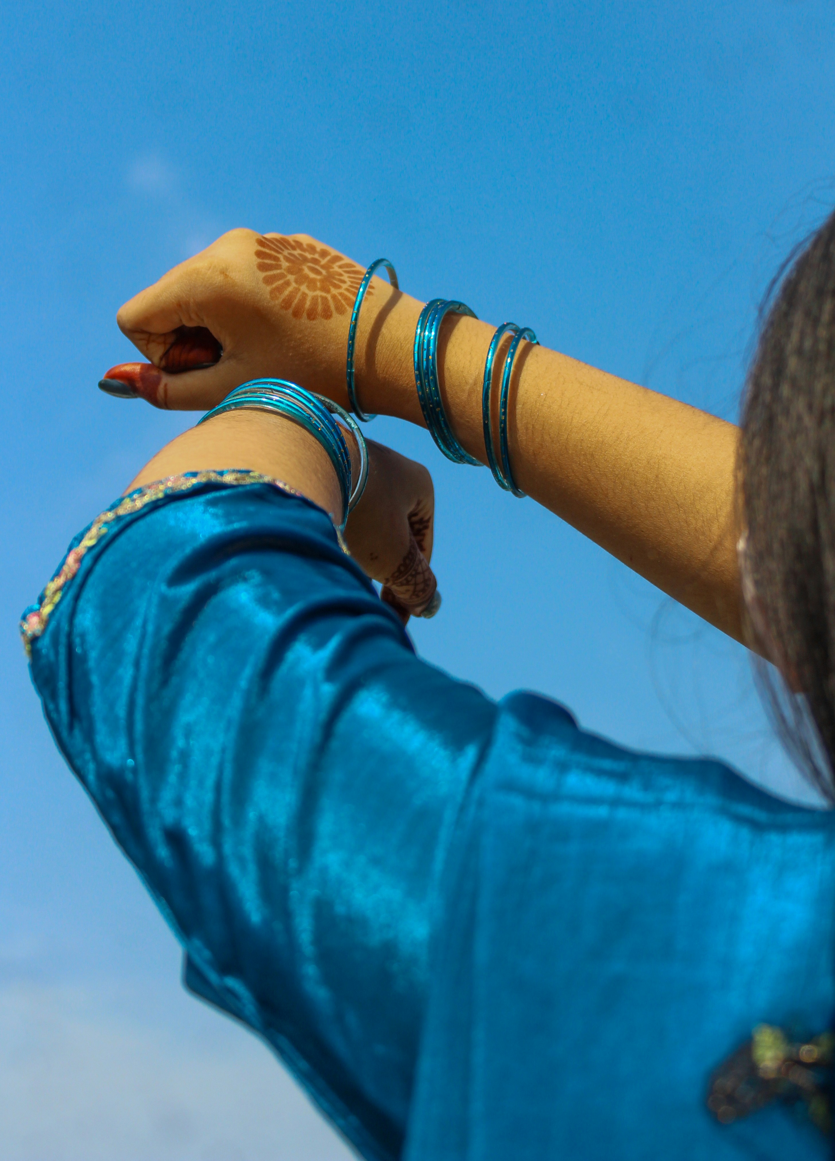 Raise to the Sky: A Lively Arm in Bright Blue