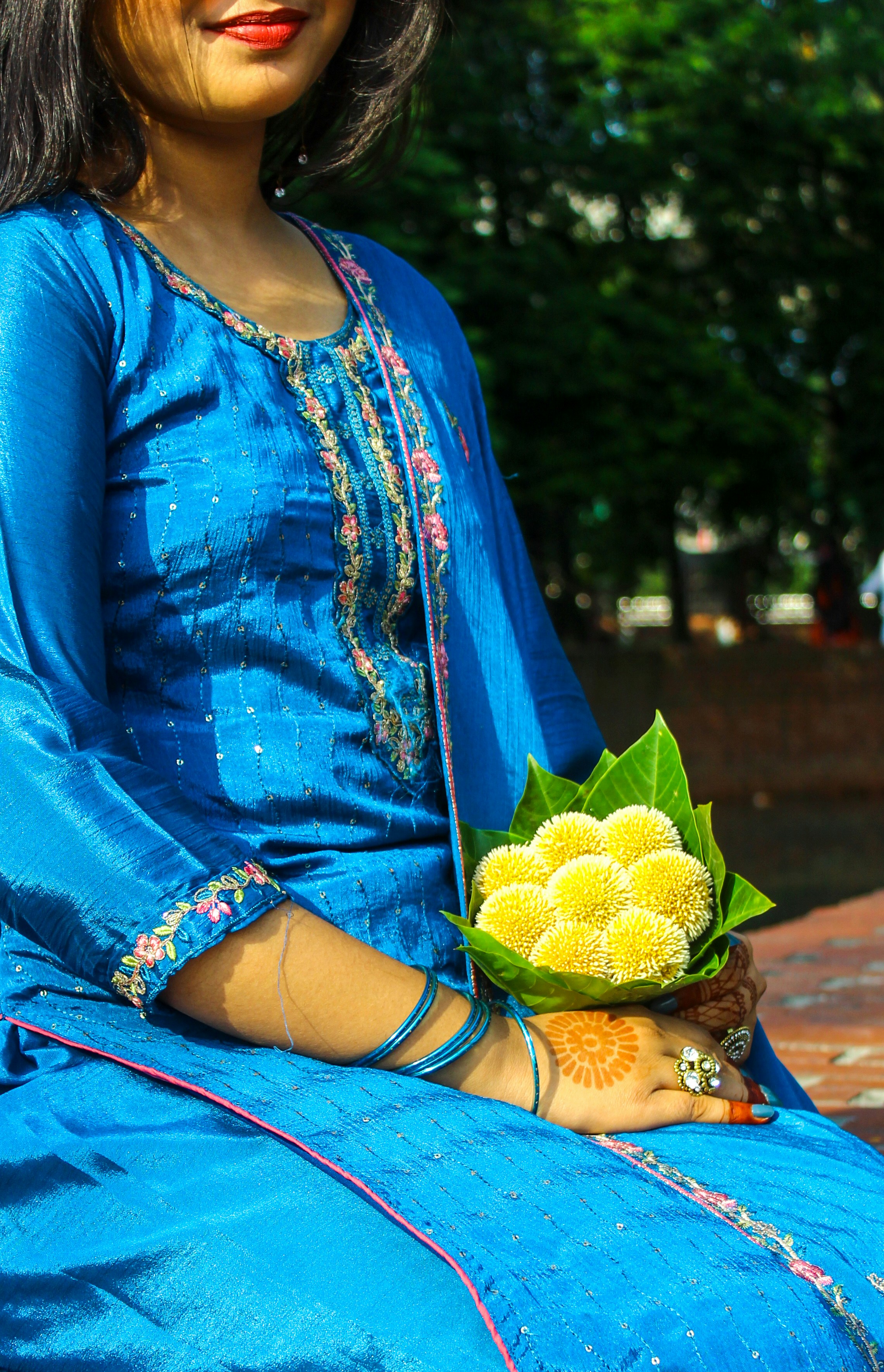 Blue Silk, Yellow Bloom: A Quiet Portrait in Sunlit Garden