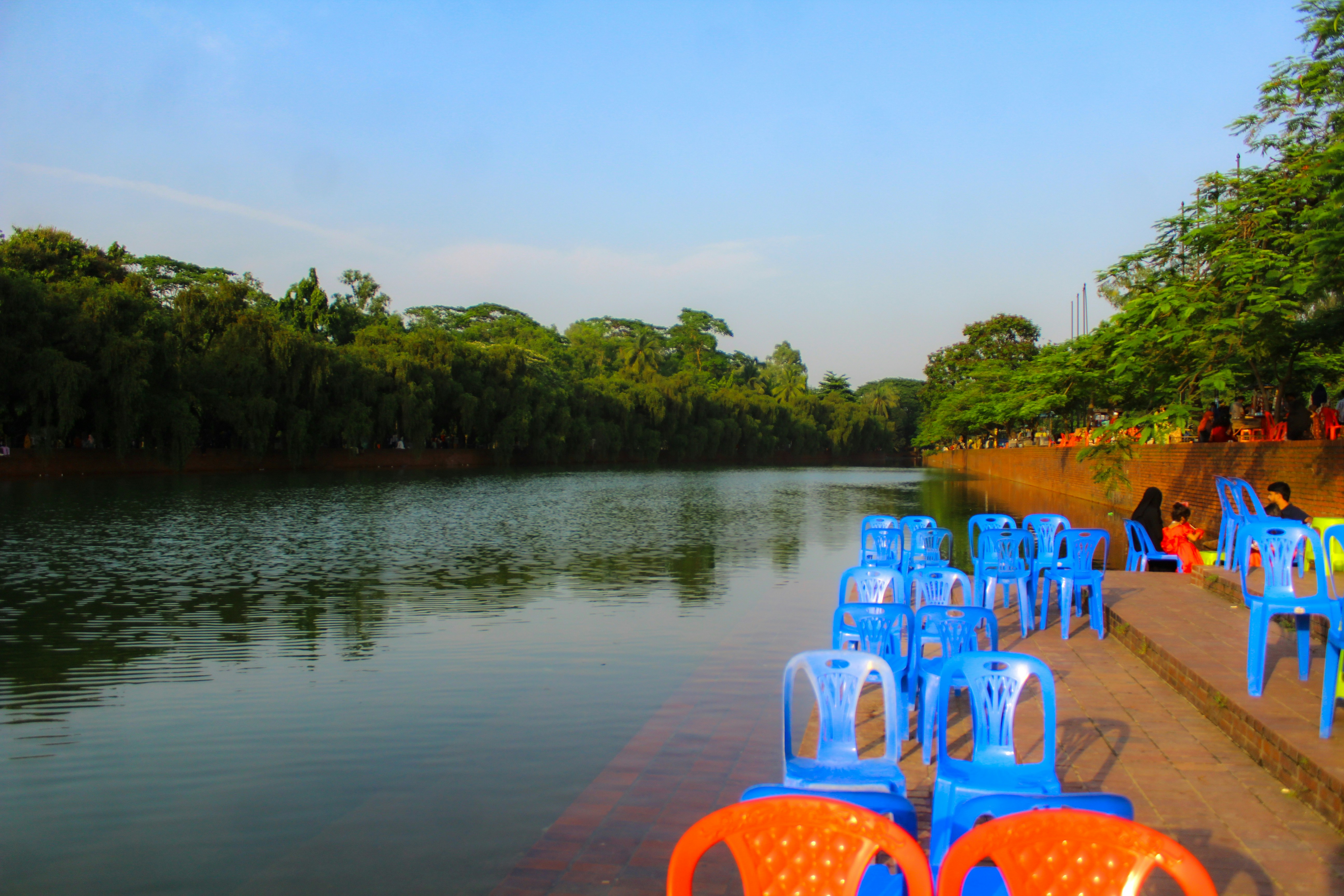Blue Chairs on the Riverside: Quiet Lakefront Afternoon