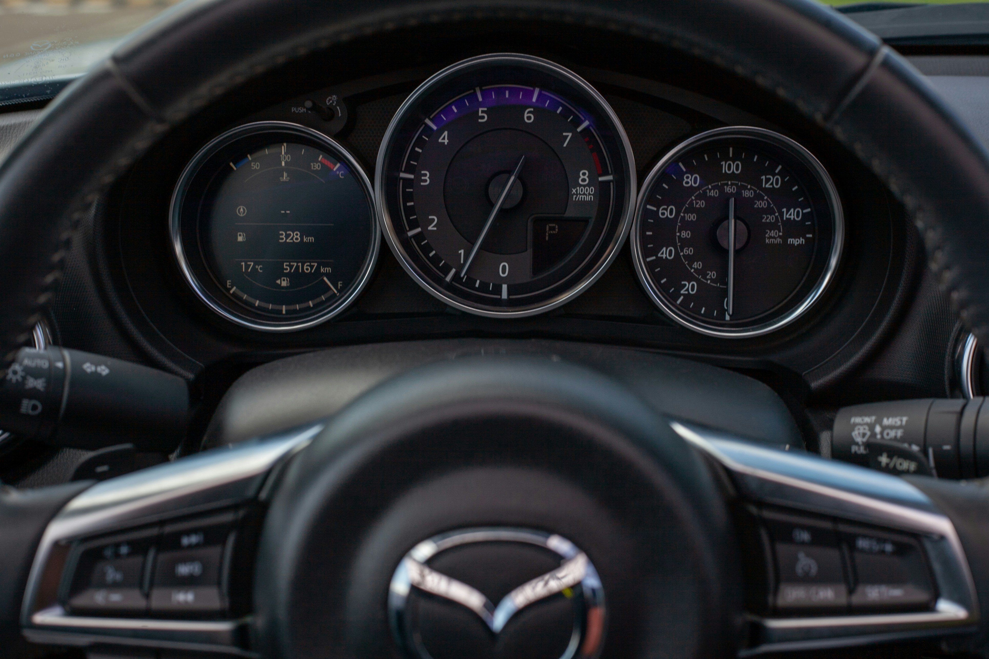 Steering Wheel Focus: Precision Gauged in a Mazda Cockpit