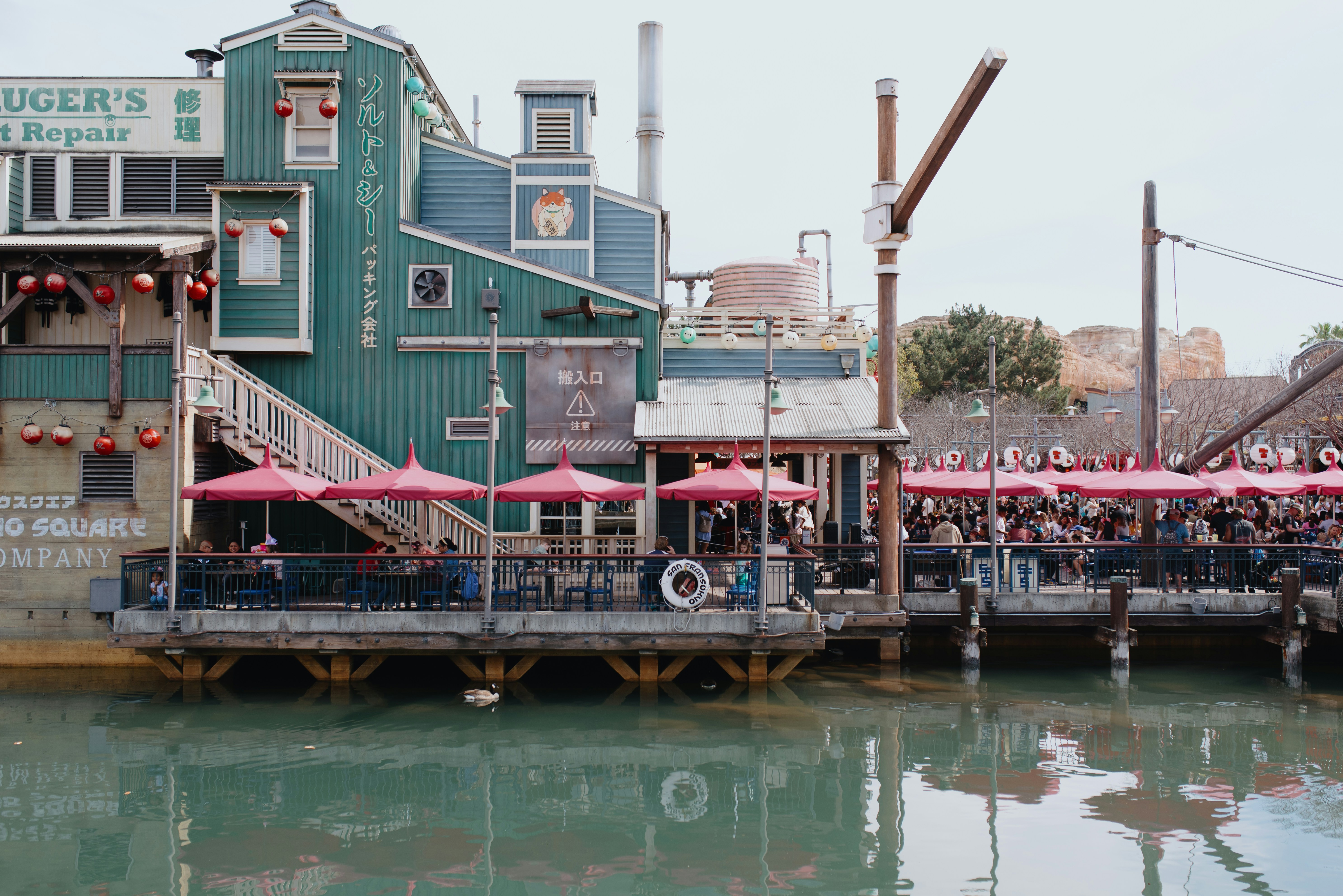Floating Wharf Tavern: Colorful Waterfront Hub of Activity