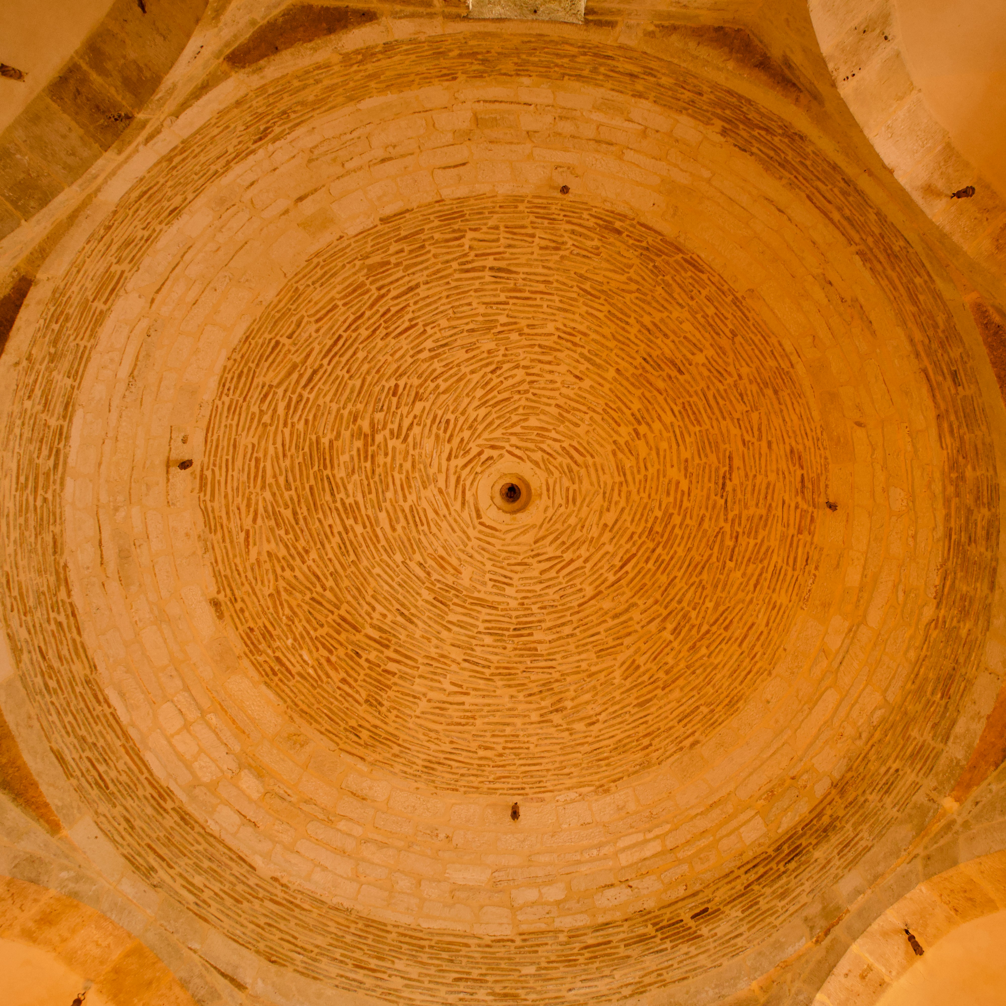 Circular Echoes: An Ocher Spiral of Stone