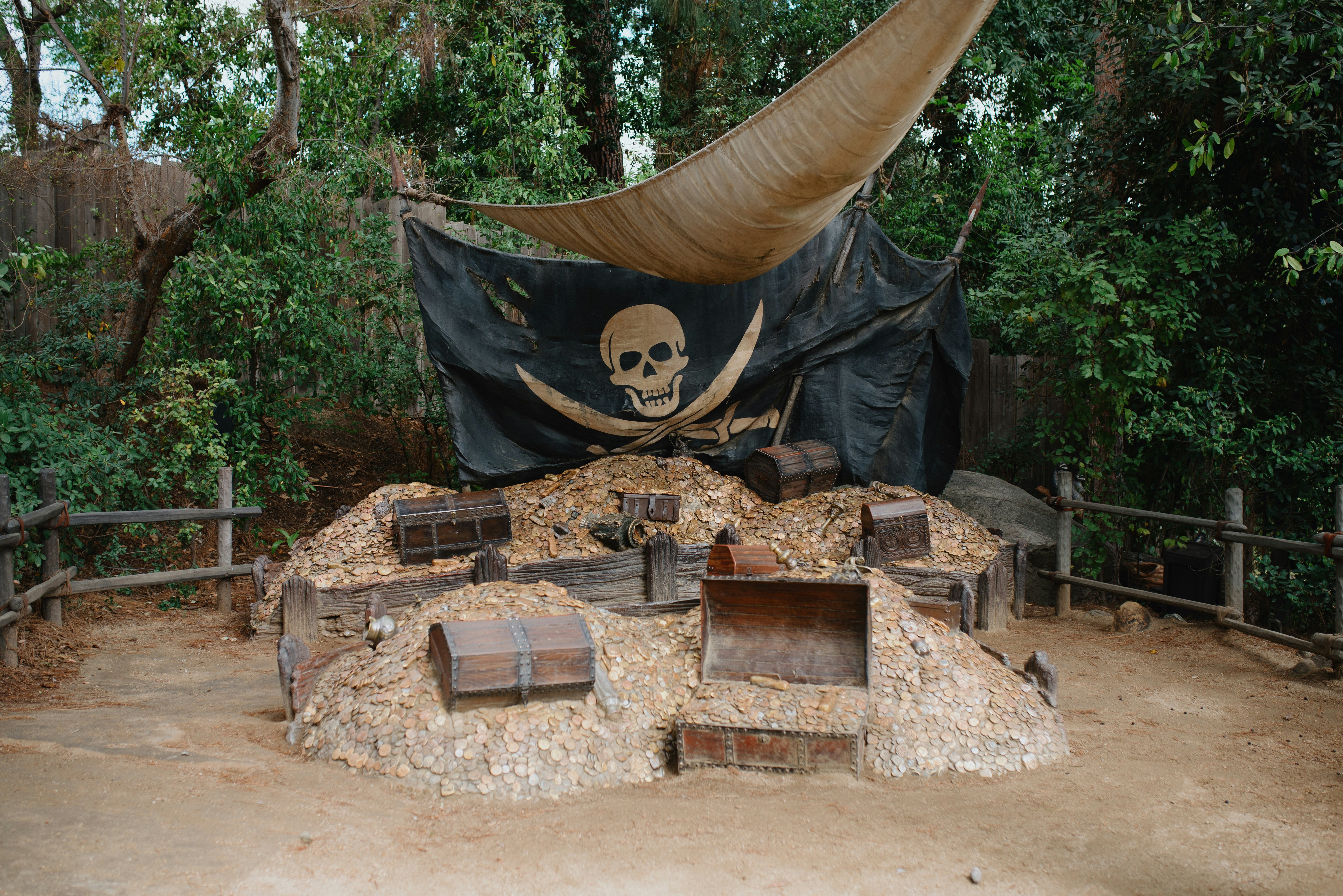 A collection of gold and a skull and crossbones pirate flag at Tom Sawyer's Island at Disneyland Park.