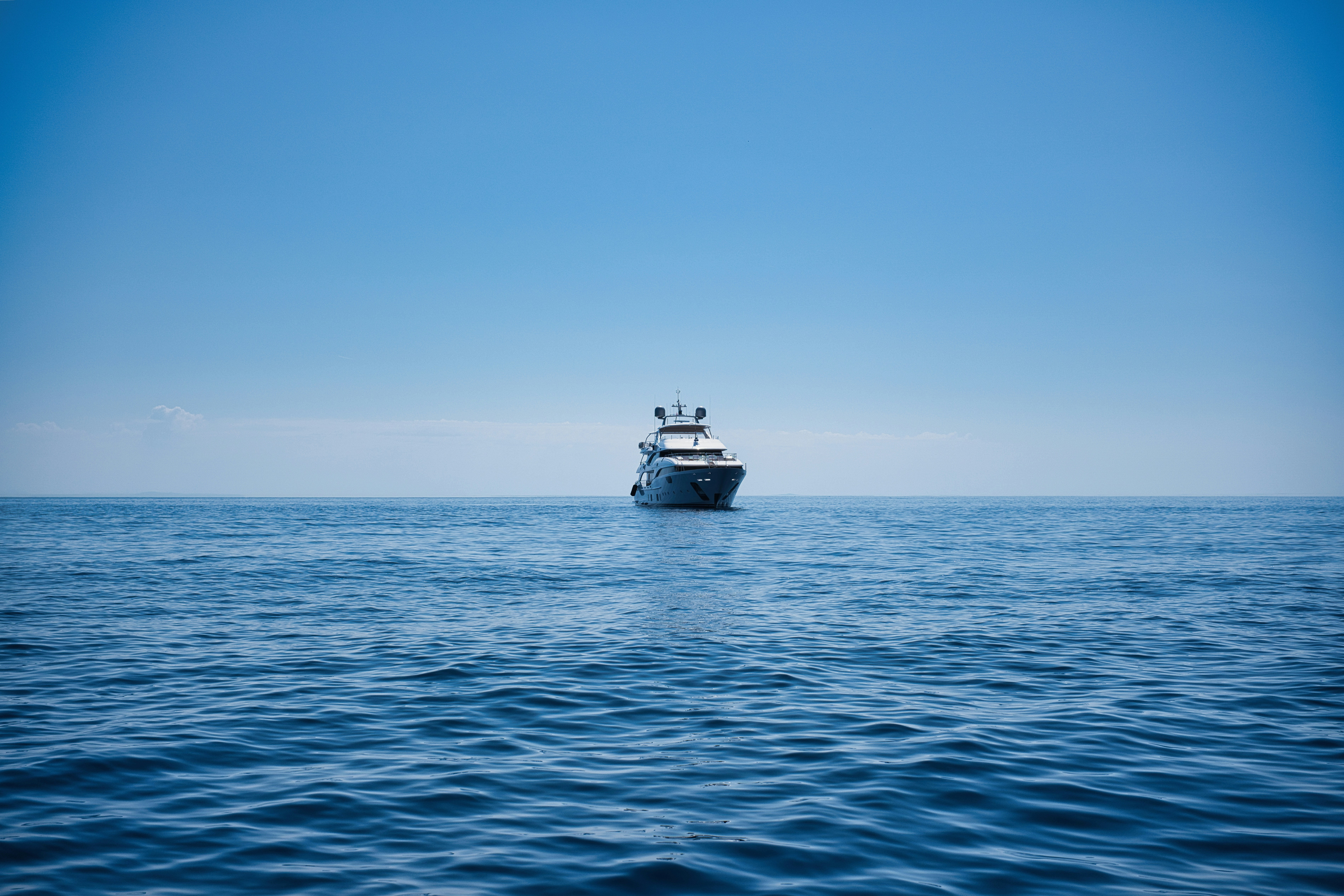 Mid-Atlantic Horizon: A solo yacht on calm blue vastness