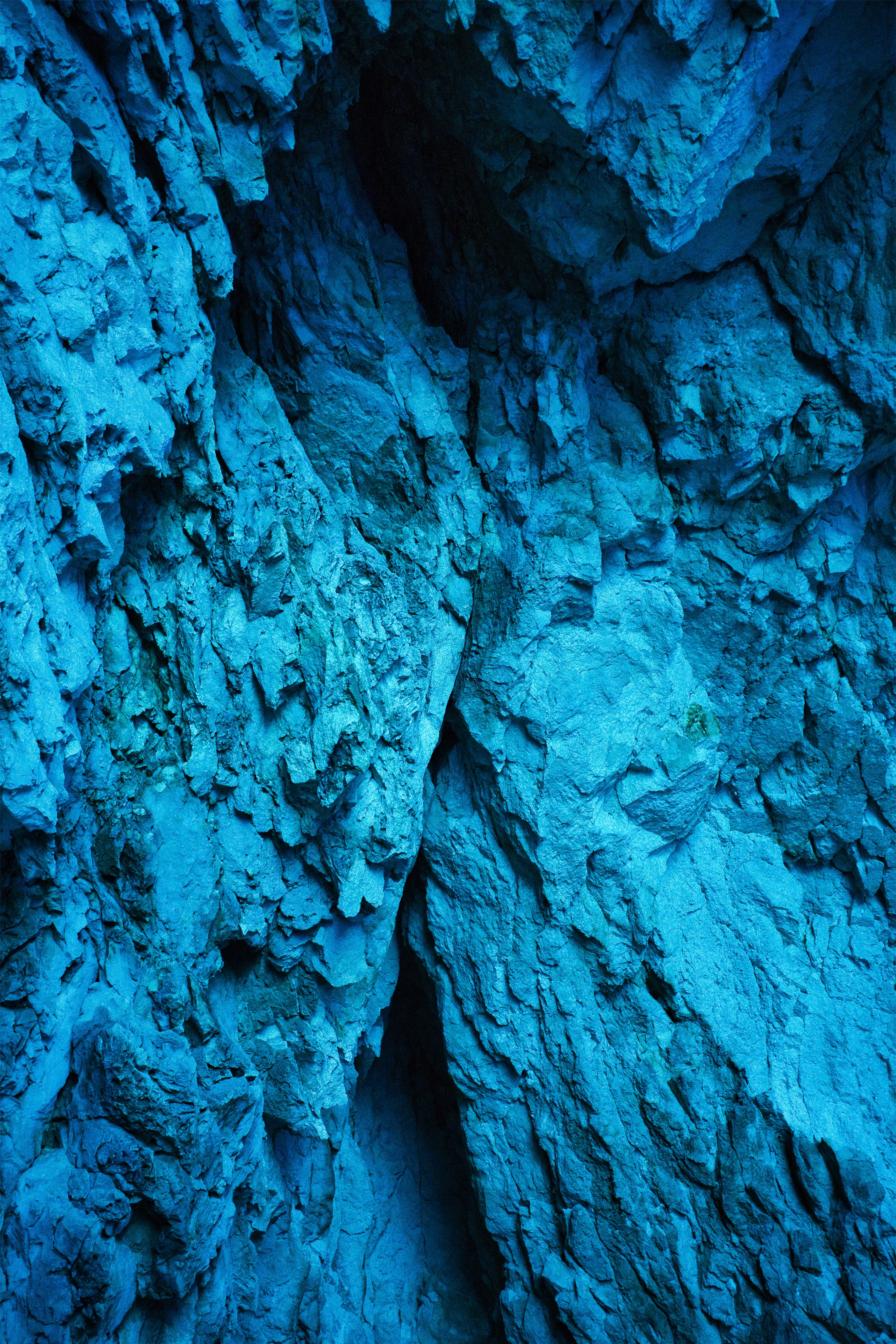Blue Grotto of Steel: A Ridge of Crystalline Rock Unfolding the Deep