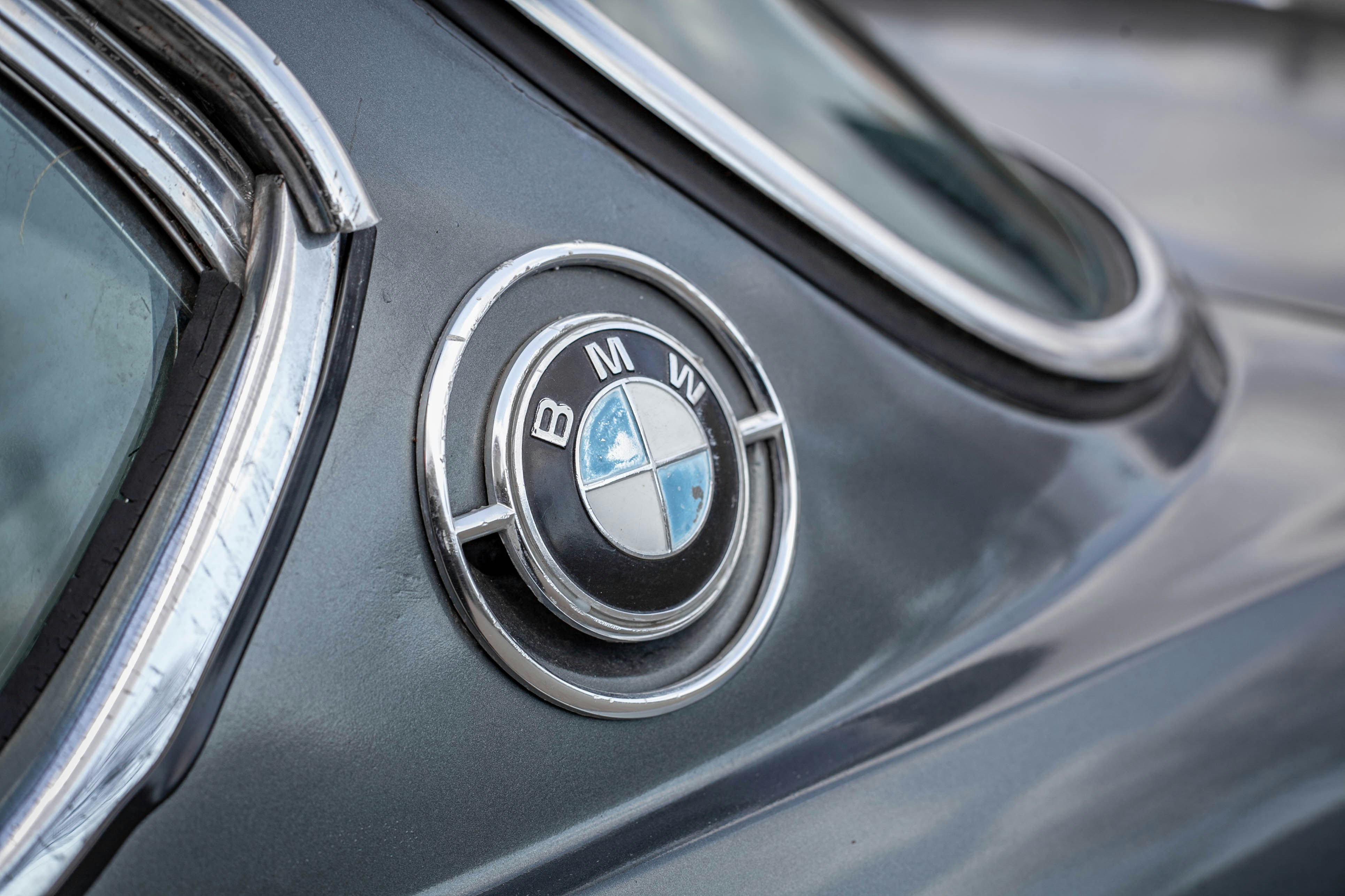 BMW Badge on Classic Car Tailfin: A Shimmering Close-Up