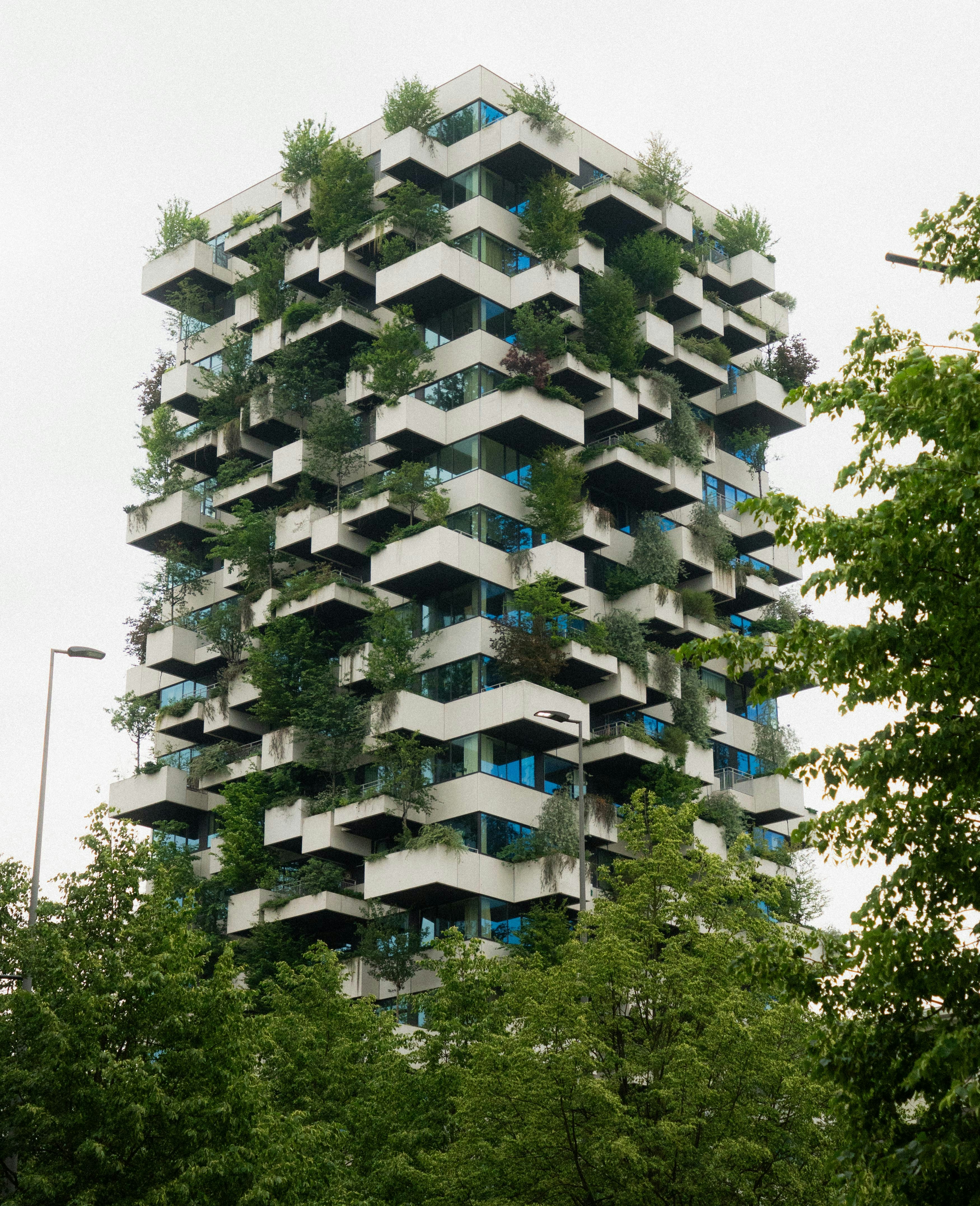 Vertical Forest: A Concrete Hex with Greenery Crowning a Modern Tower