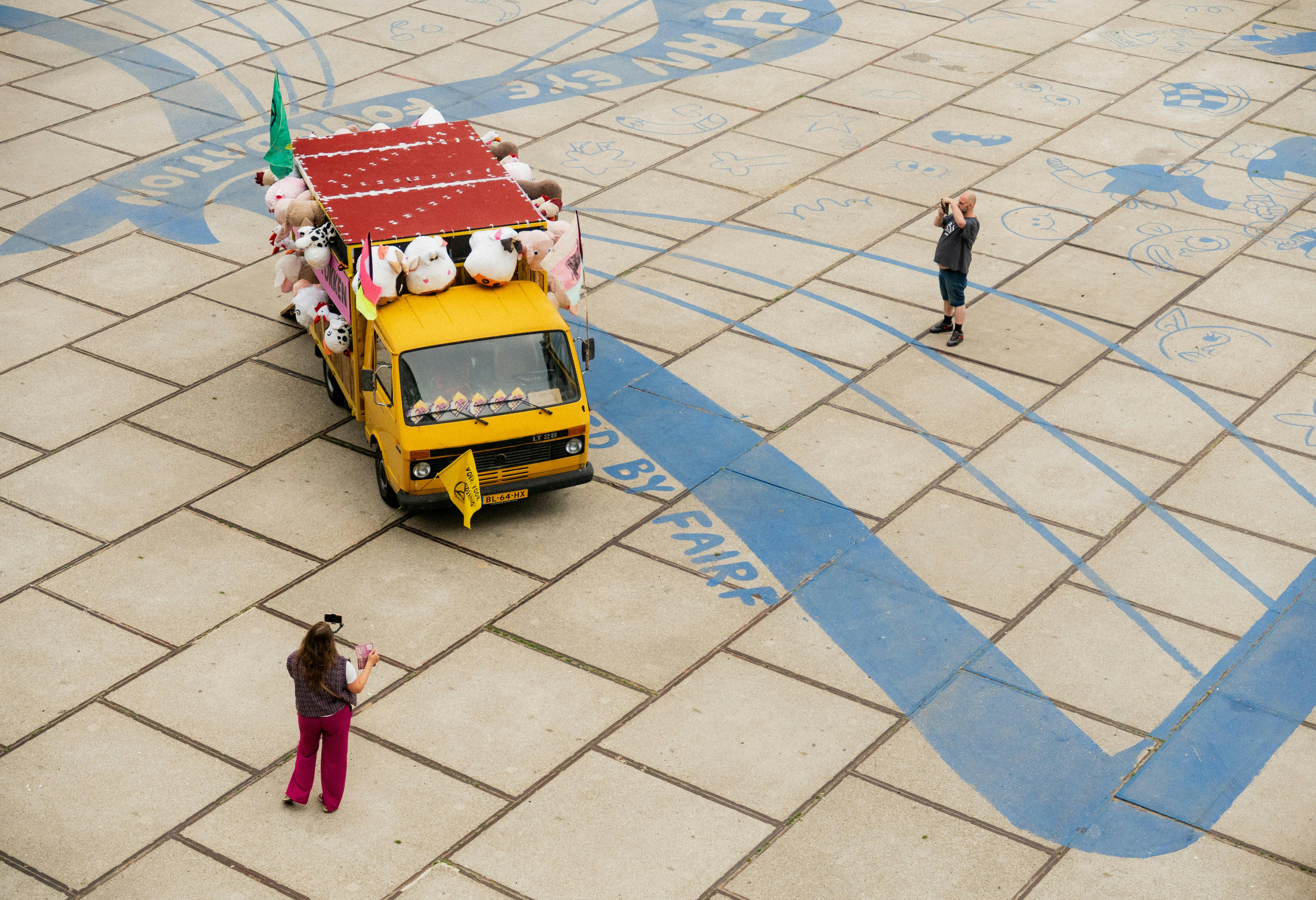 Yellow Truck Parade: Aerial View of Festive Farewells