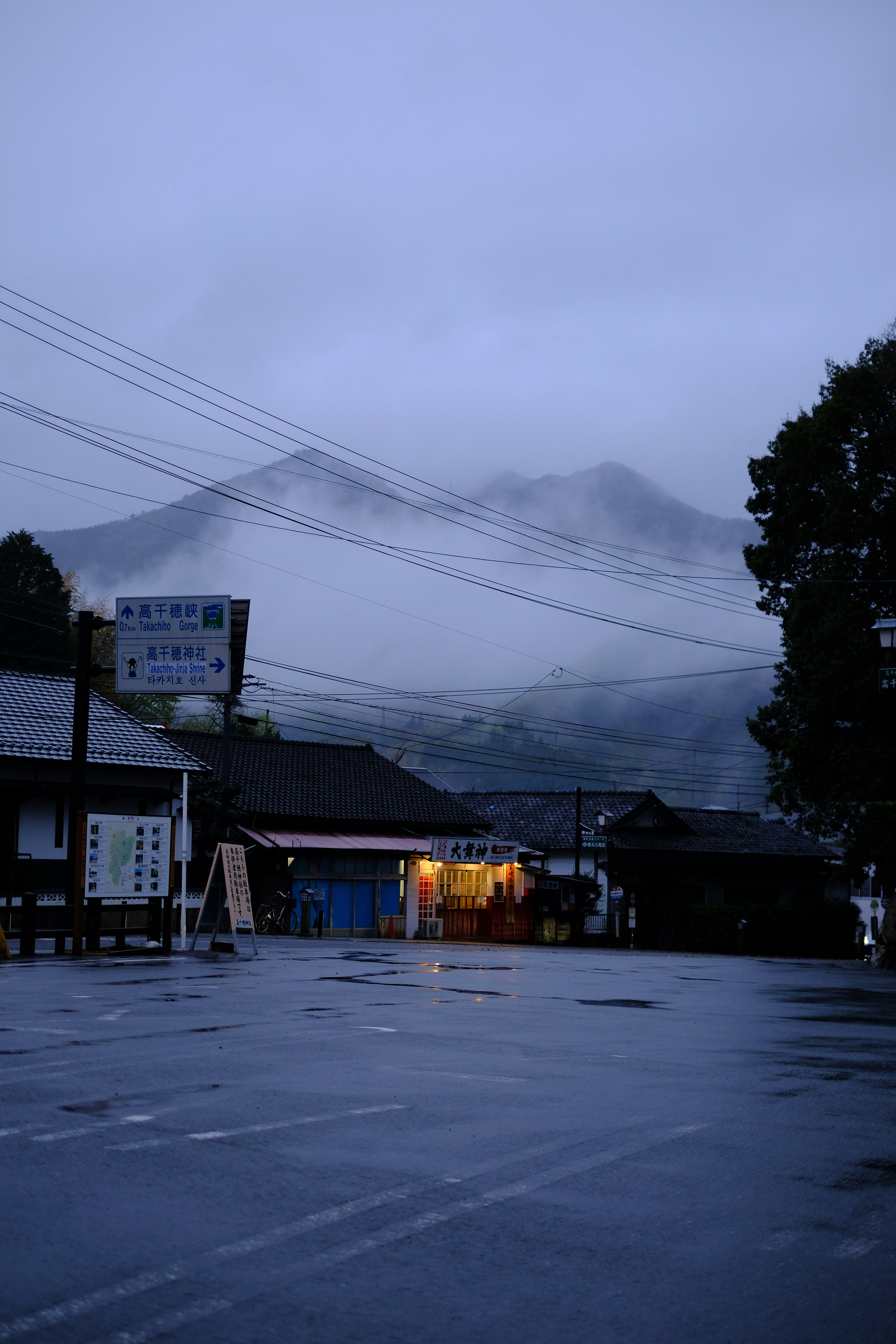 Dawn in a Quiet Mountain Town Under Soft Mist