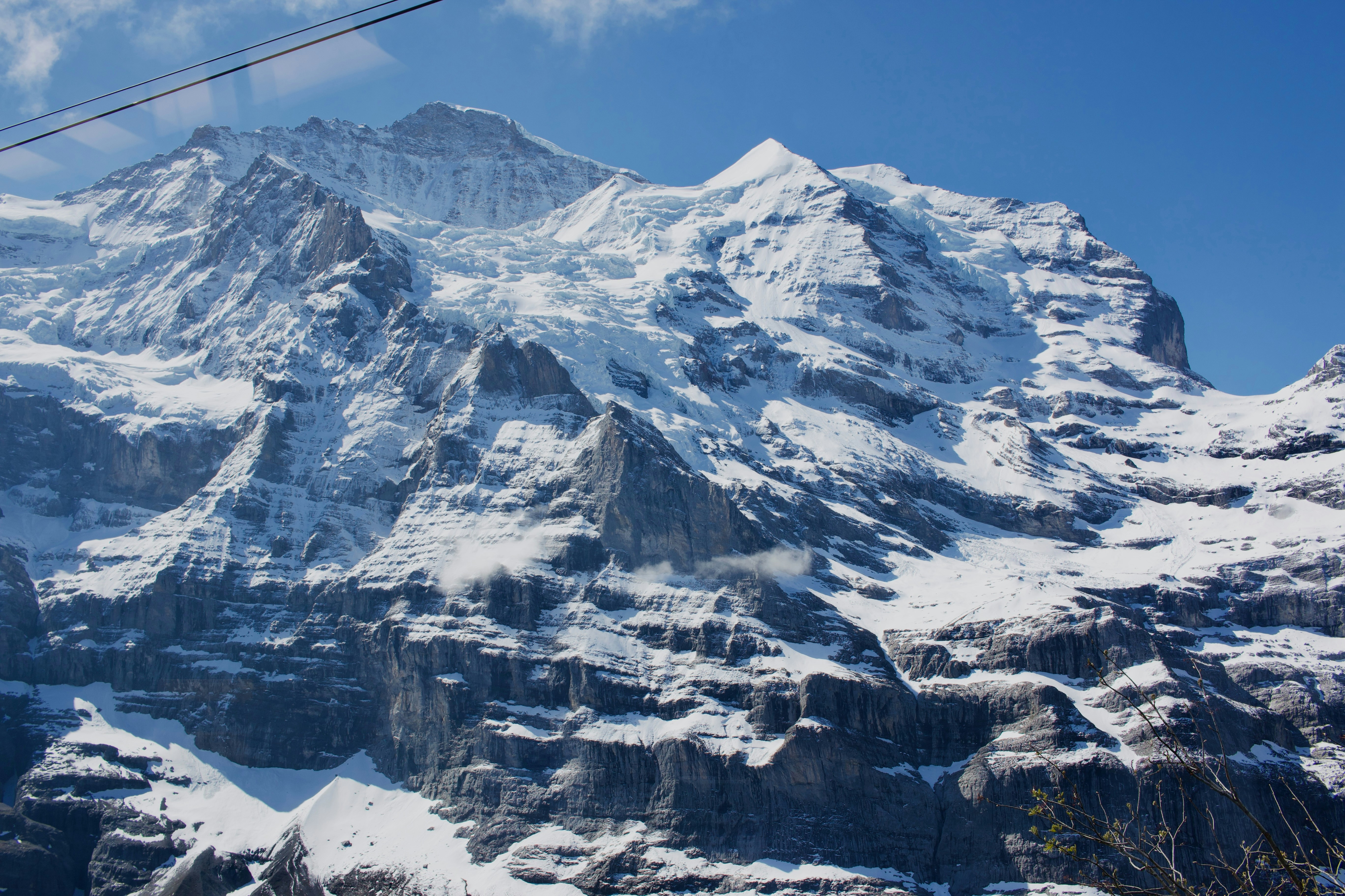 Snowbound Giants: A Razor-Sharp Peak Above the Alpine Valleys