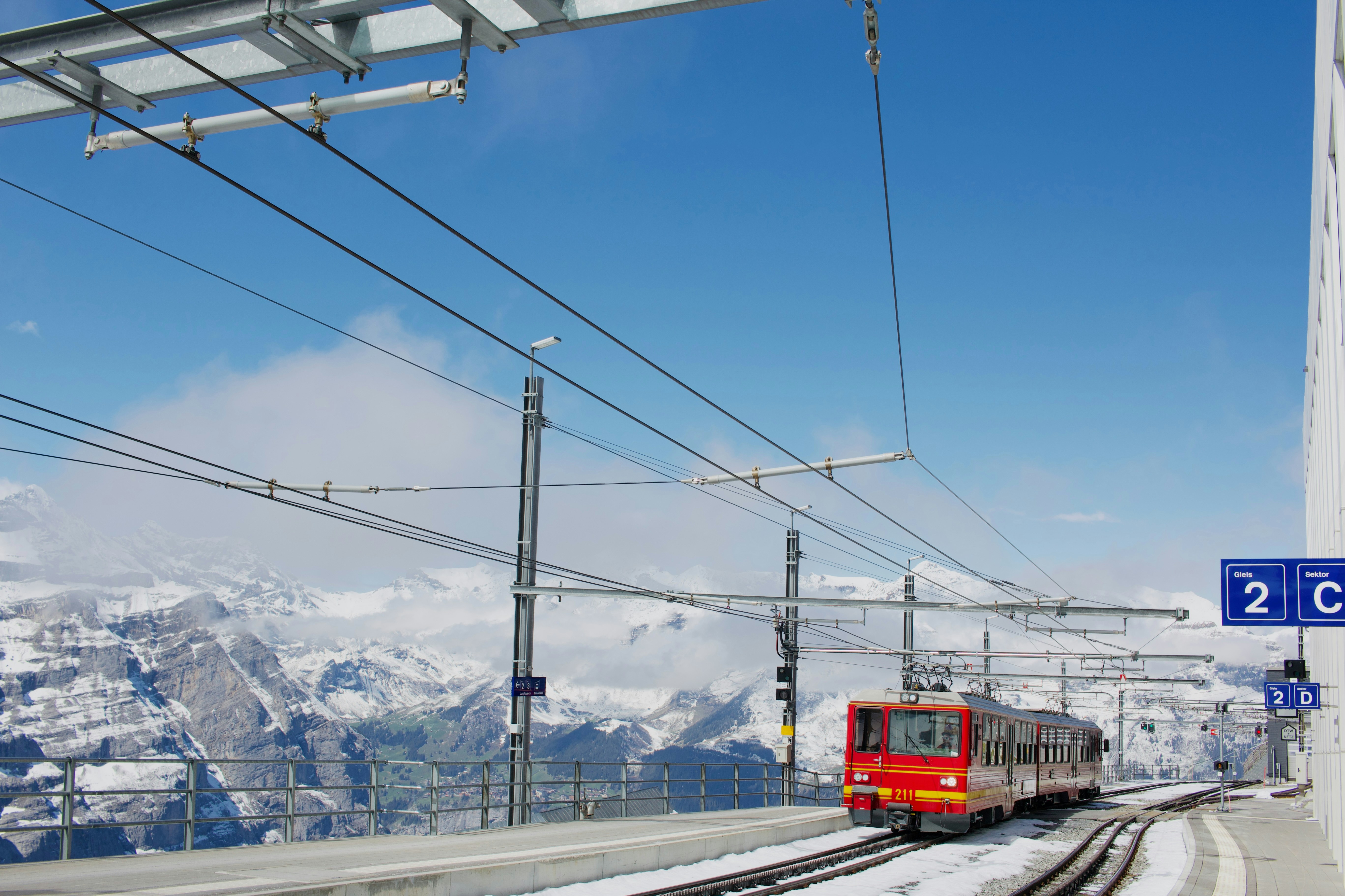 Red Comet on Snowbound Rails: A Swiss Alpine Transit