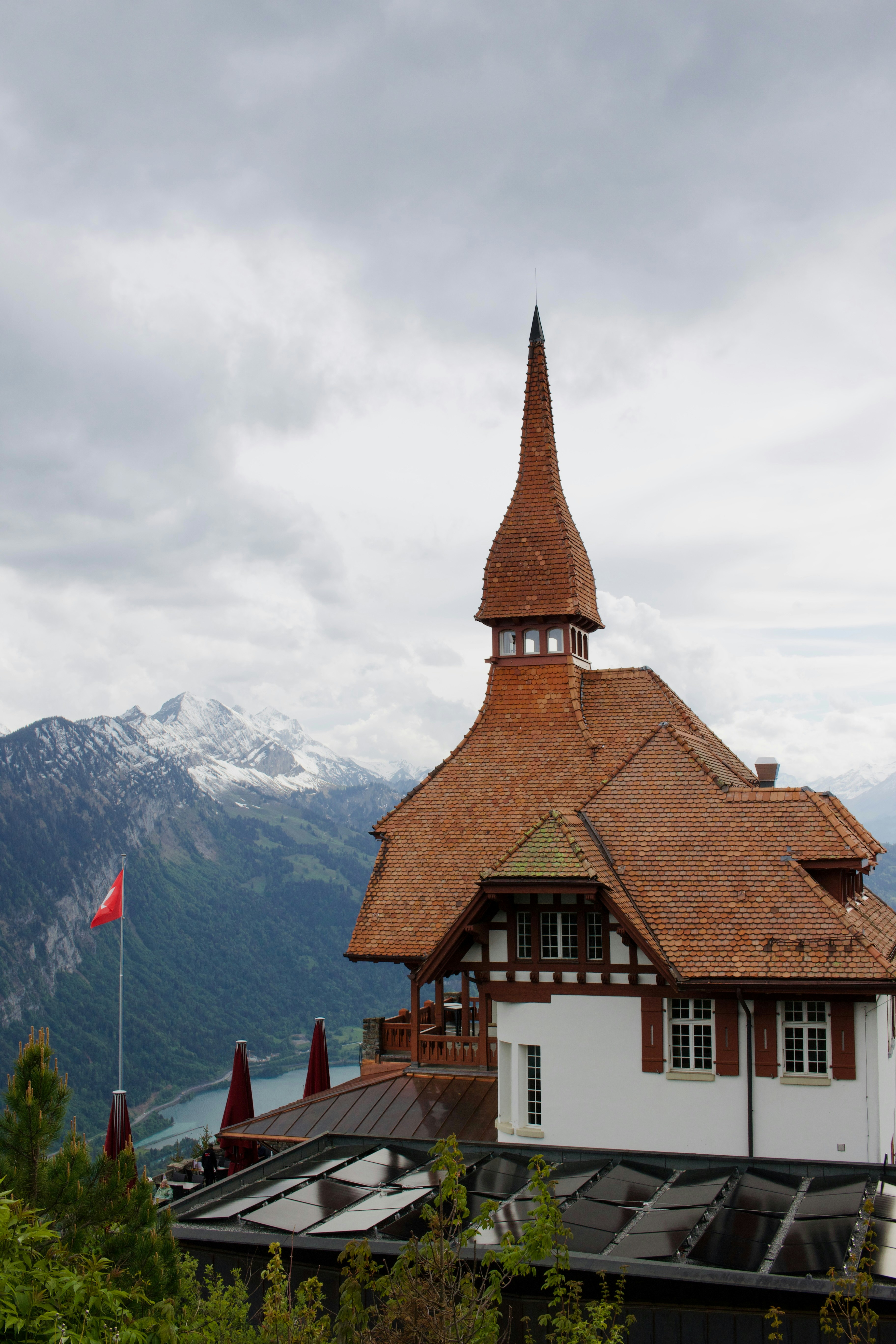 Chalet Peak: A Swiss-Tinted Roof Against Alpine Clouds