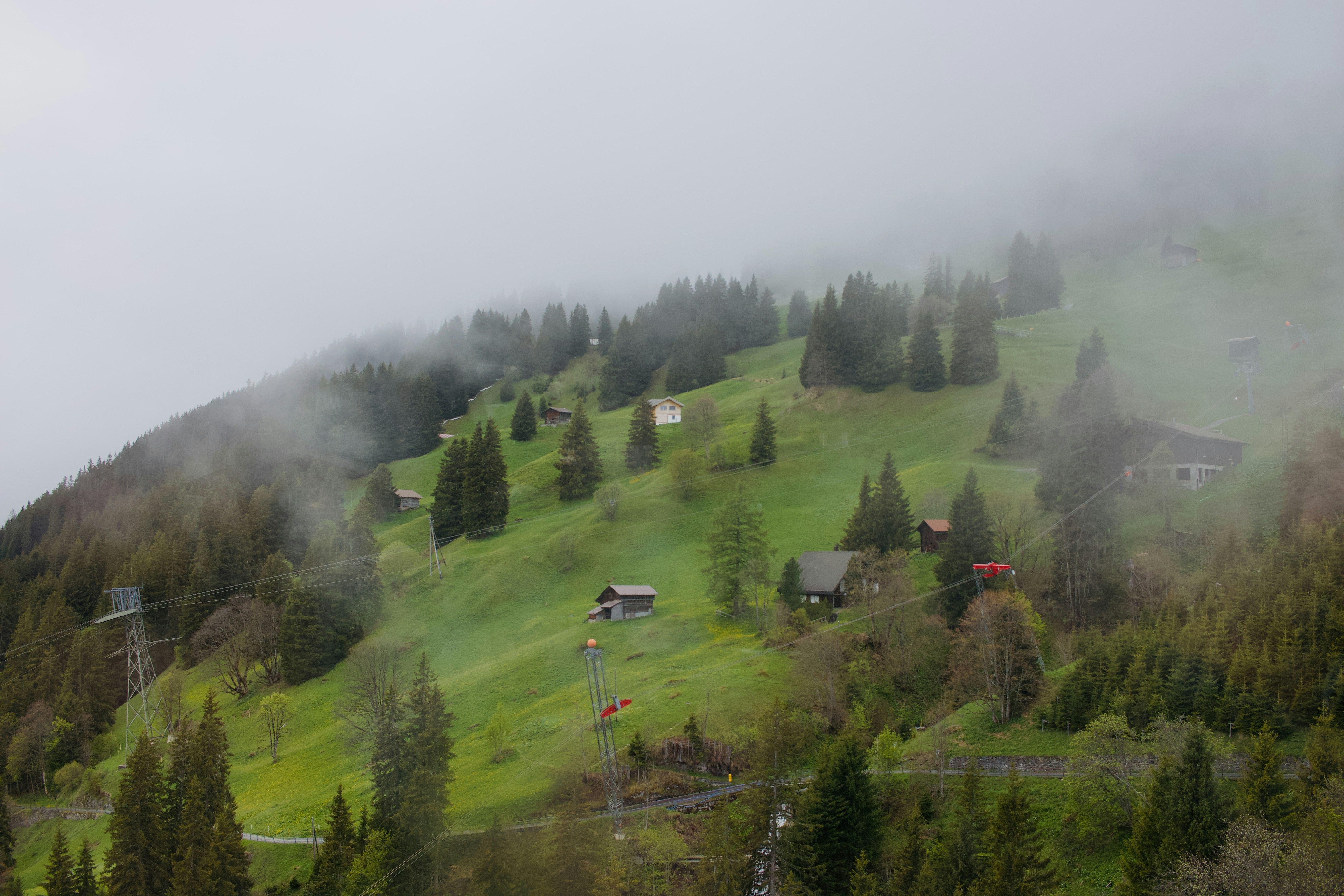 Misty Alpine hamlets tucked along a verdant hillside