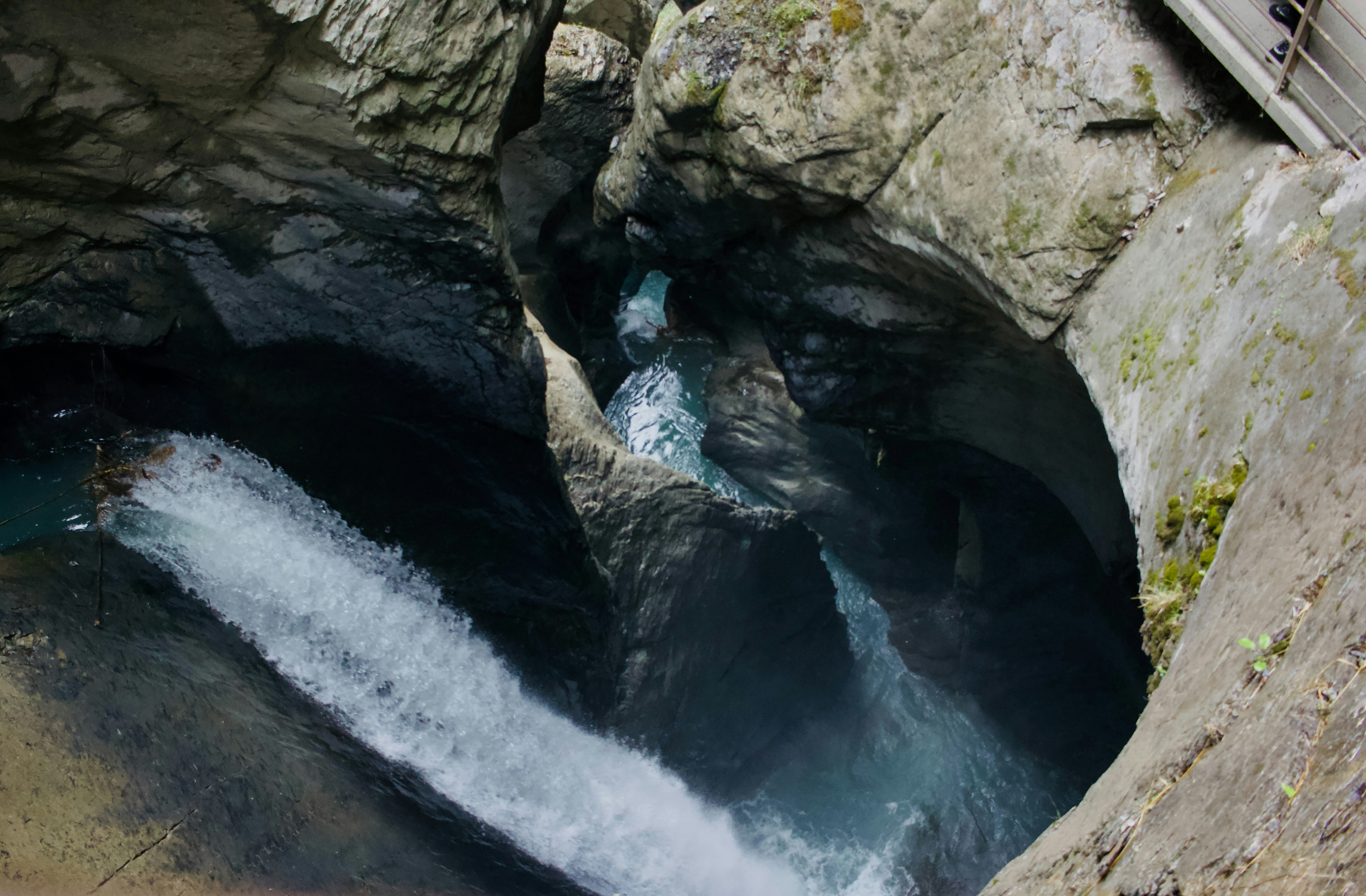 Hidden Plunge: Waterfalled Cleft in a Stone Chasm