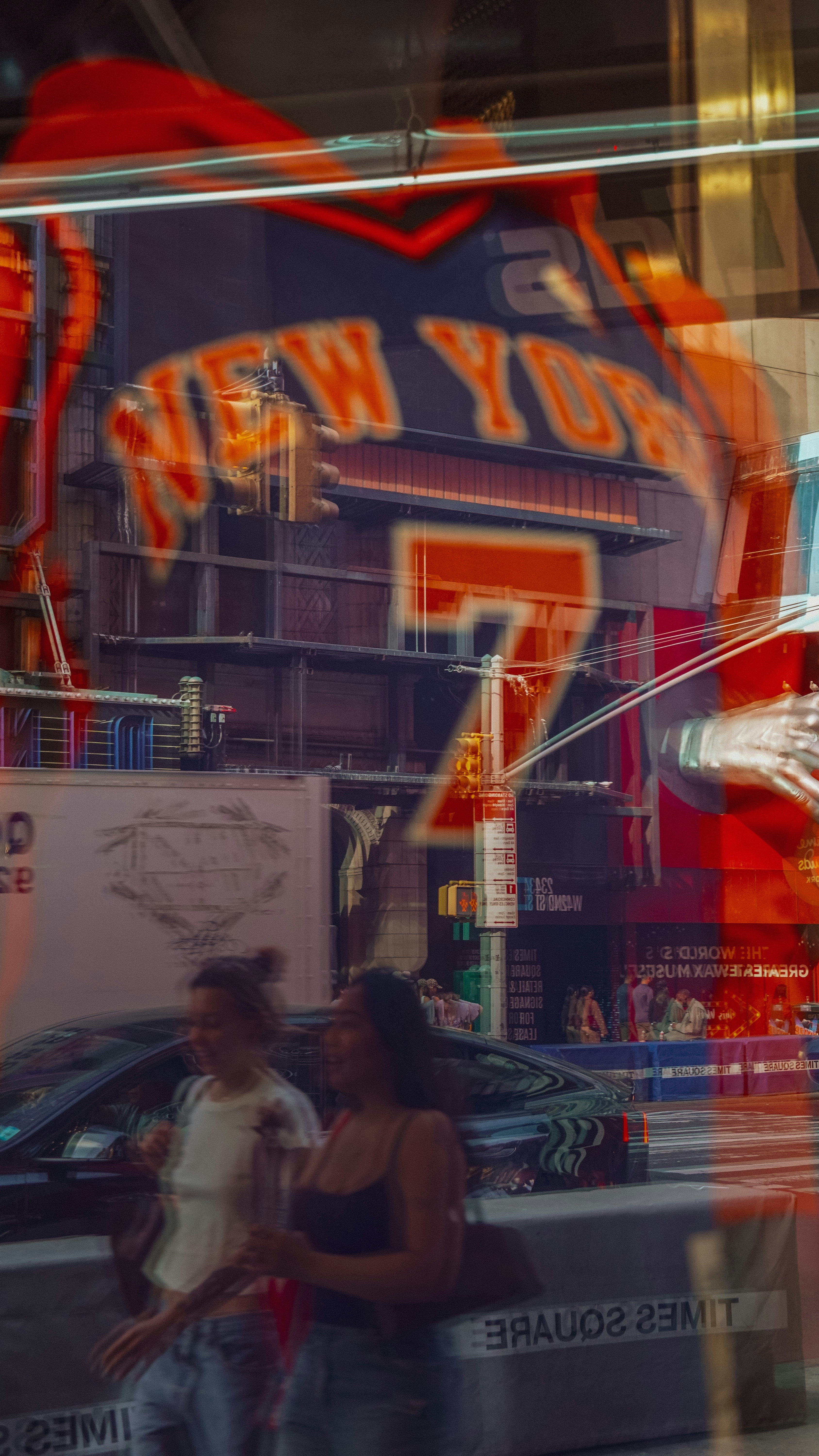 Neon Reflections on a Moving City