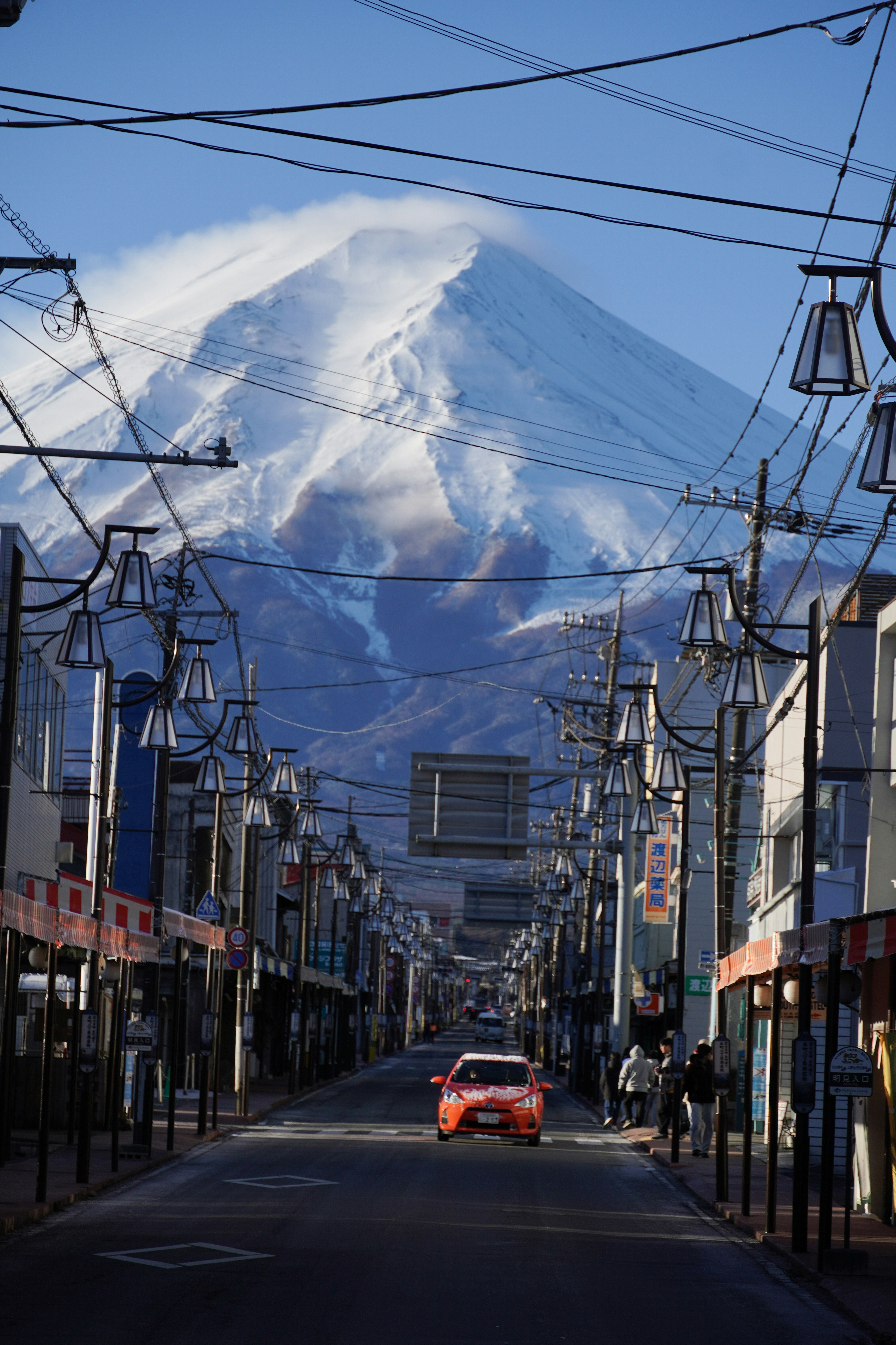 Mt. Fuji Awash in Streetlight Ripples: A Quiet Street Framed by Cables