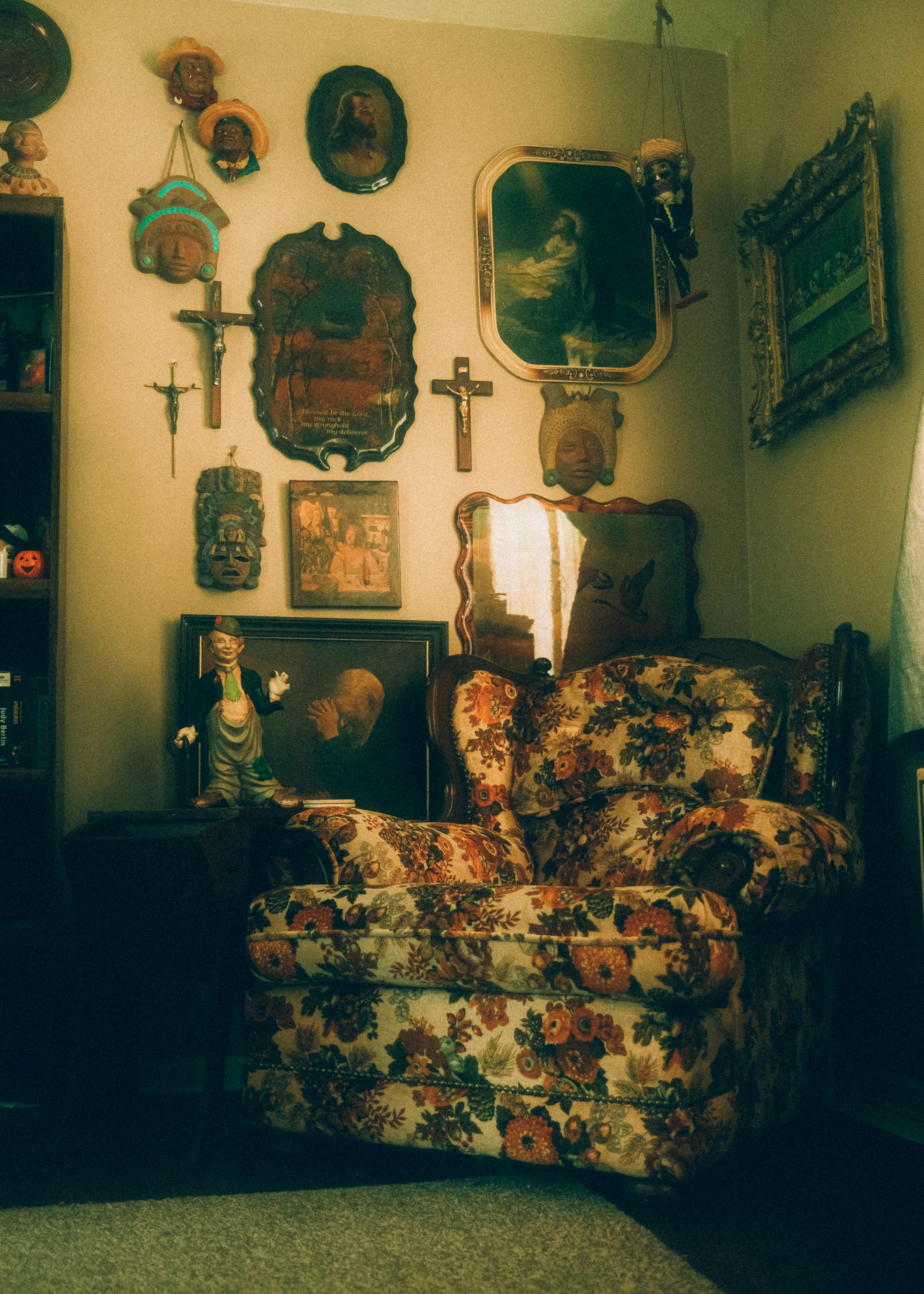 Curio Corner: A Vintage Lounge of Masks, Frames, and Floral Upholstery