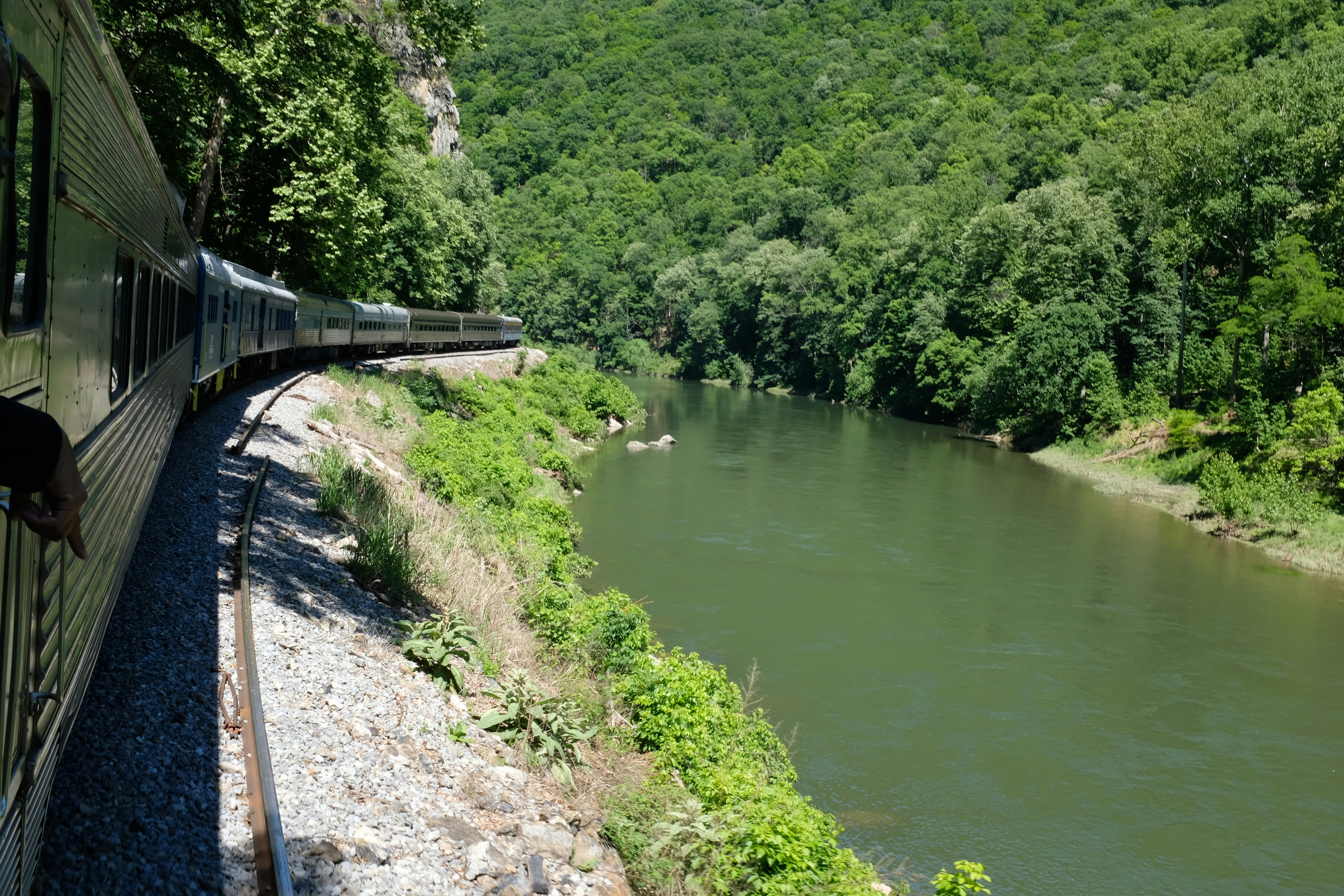 Curving Narrow-Gauge Journey Along a Riverbank
