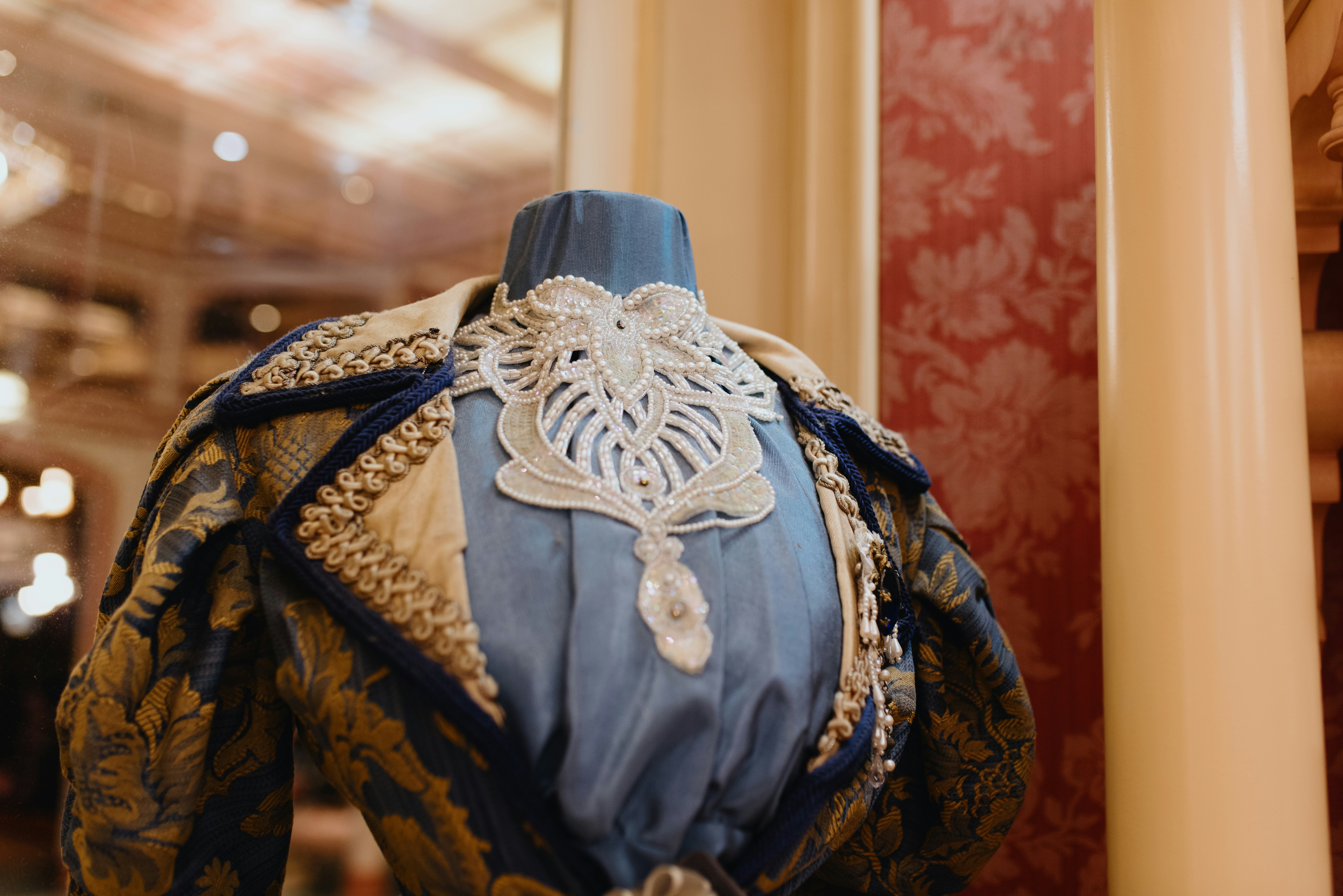 Ornate Blue Bodice with Pearl Embellishments on Vintage Display