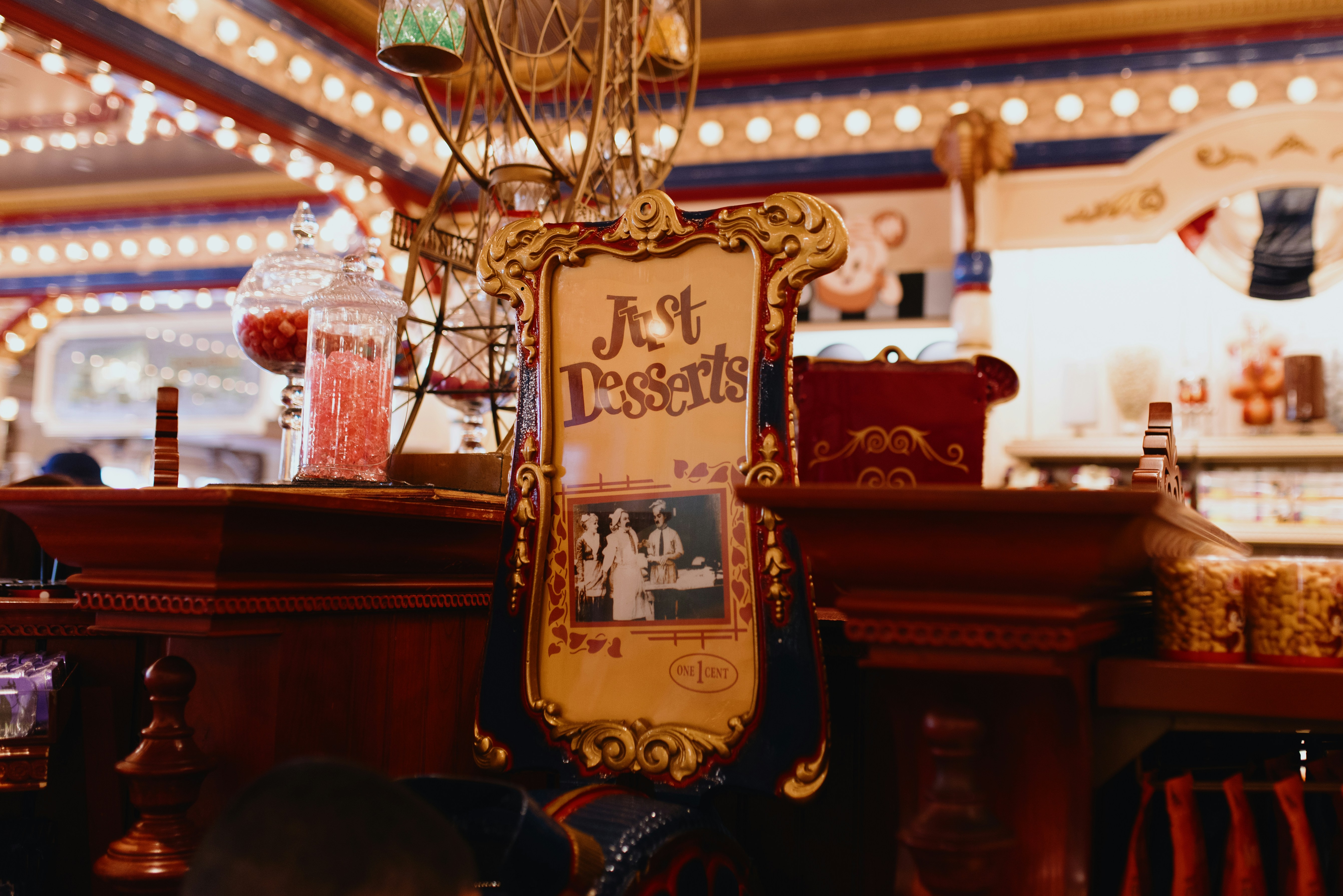 Ornate Dessert Menu Spotlight at a Vintage-Carnival Counter