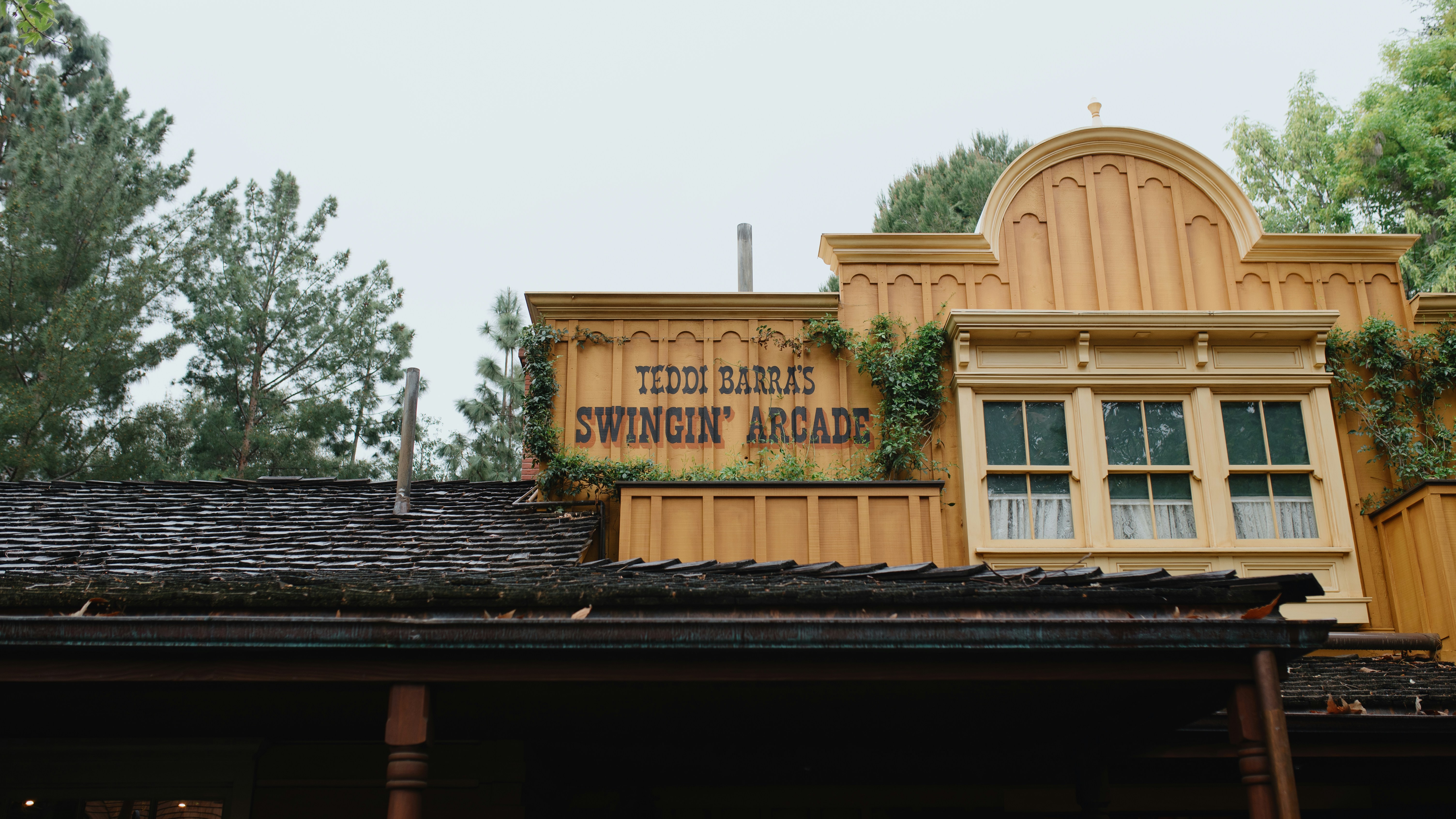 Swinging Arcade Façade: The Sign Above the Tiled Roof