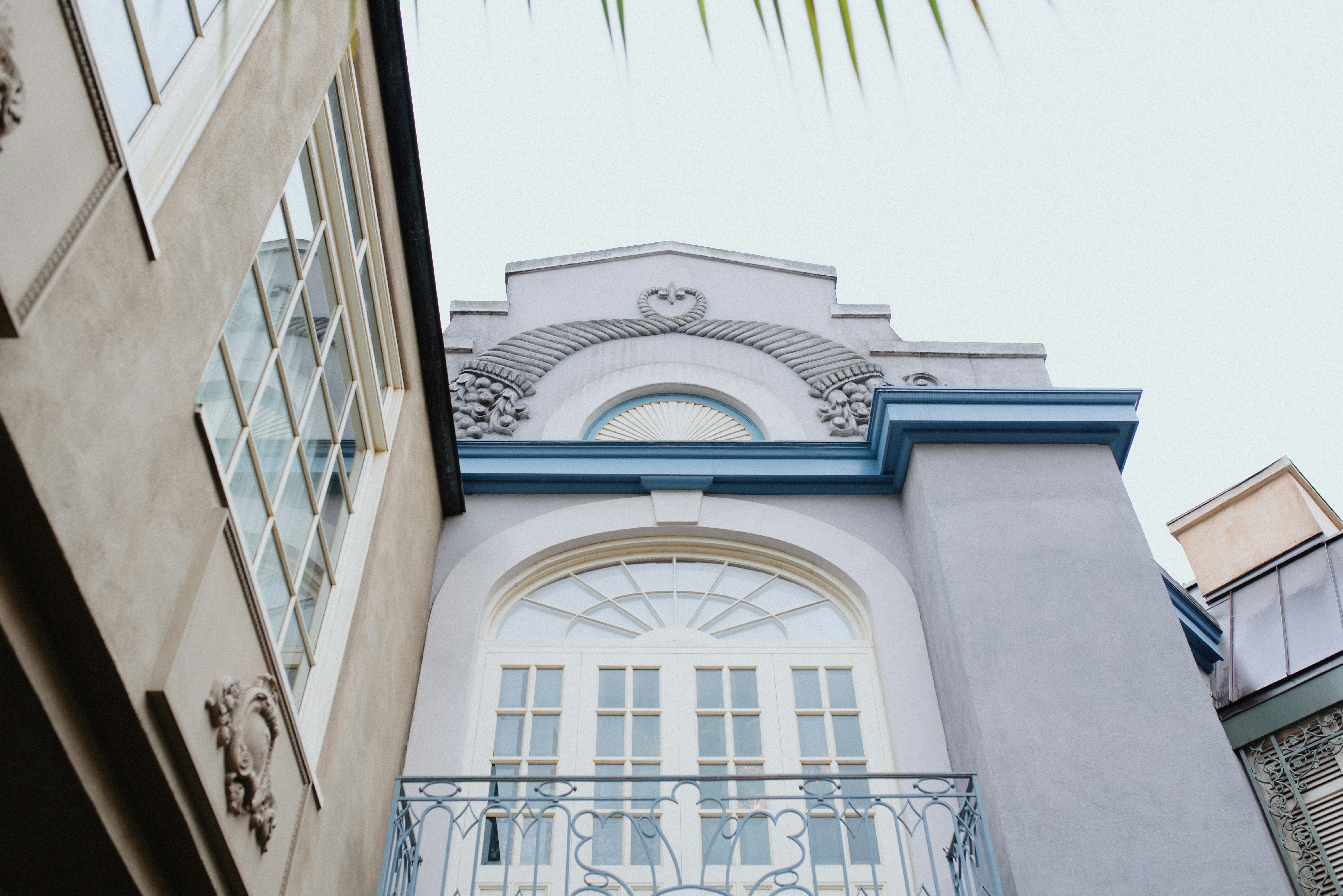 Architectural Quiet: A Balcony of Soft Pastels and Arched Windows