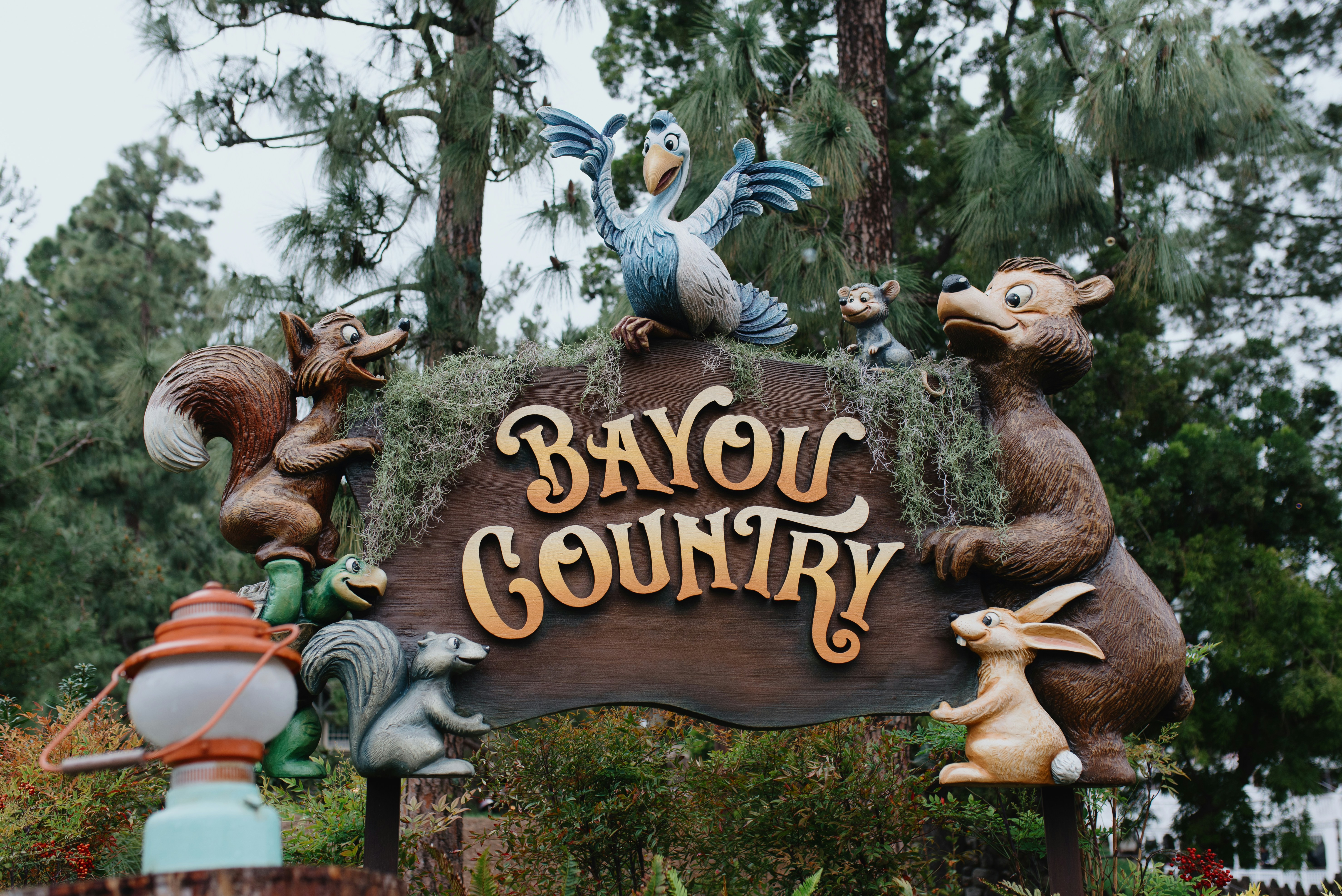 Whimsical Bayou Entrance: Storybook Animals Guard a Theatrical Sign