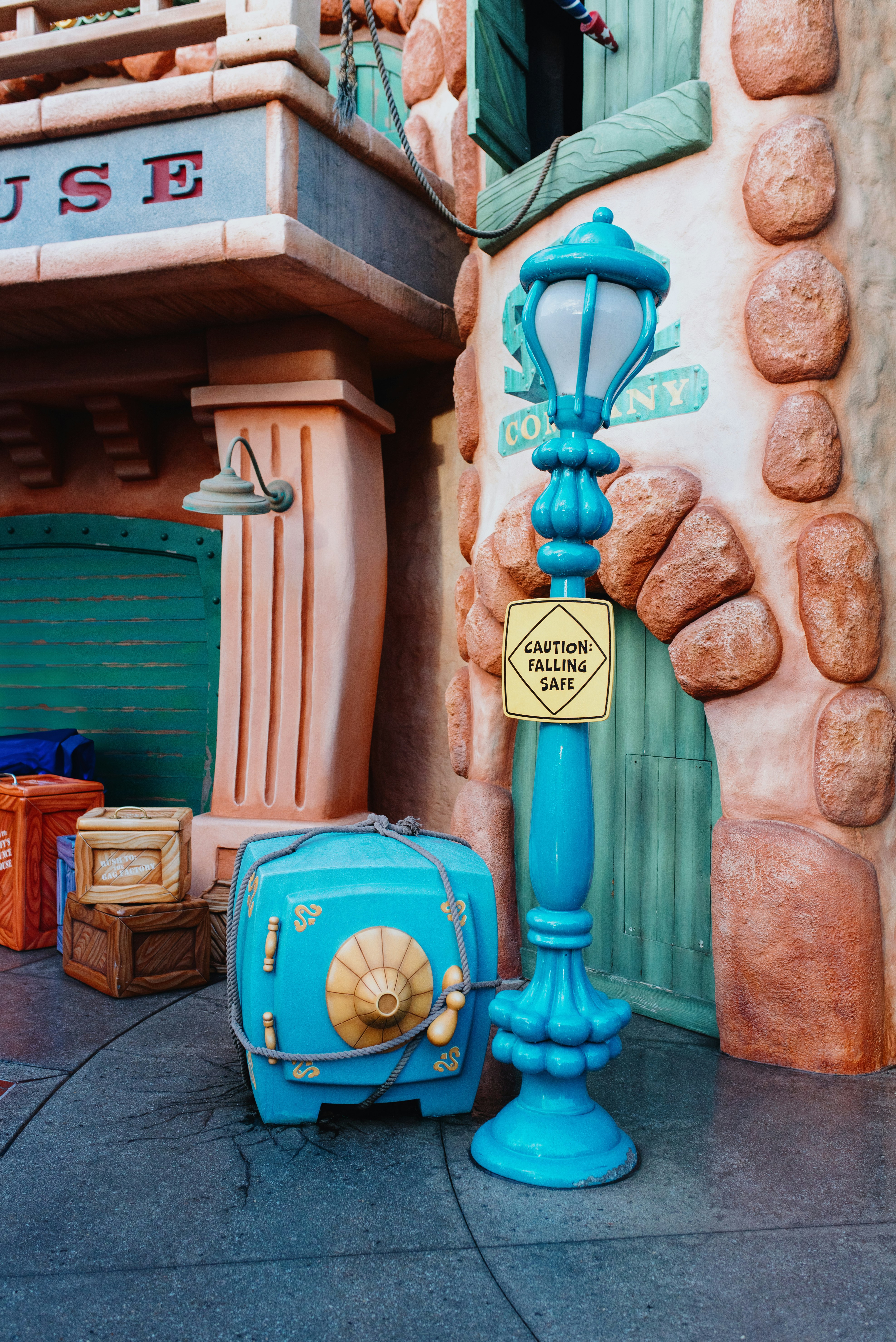 Blue Lantern and Treasure: Playground Corner under a Whimsical Sign