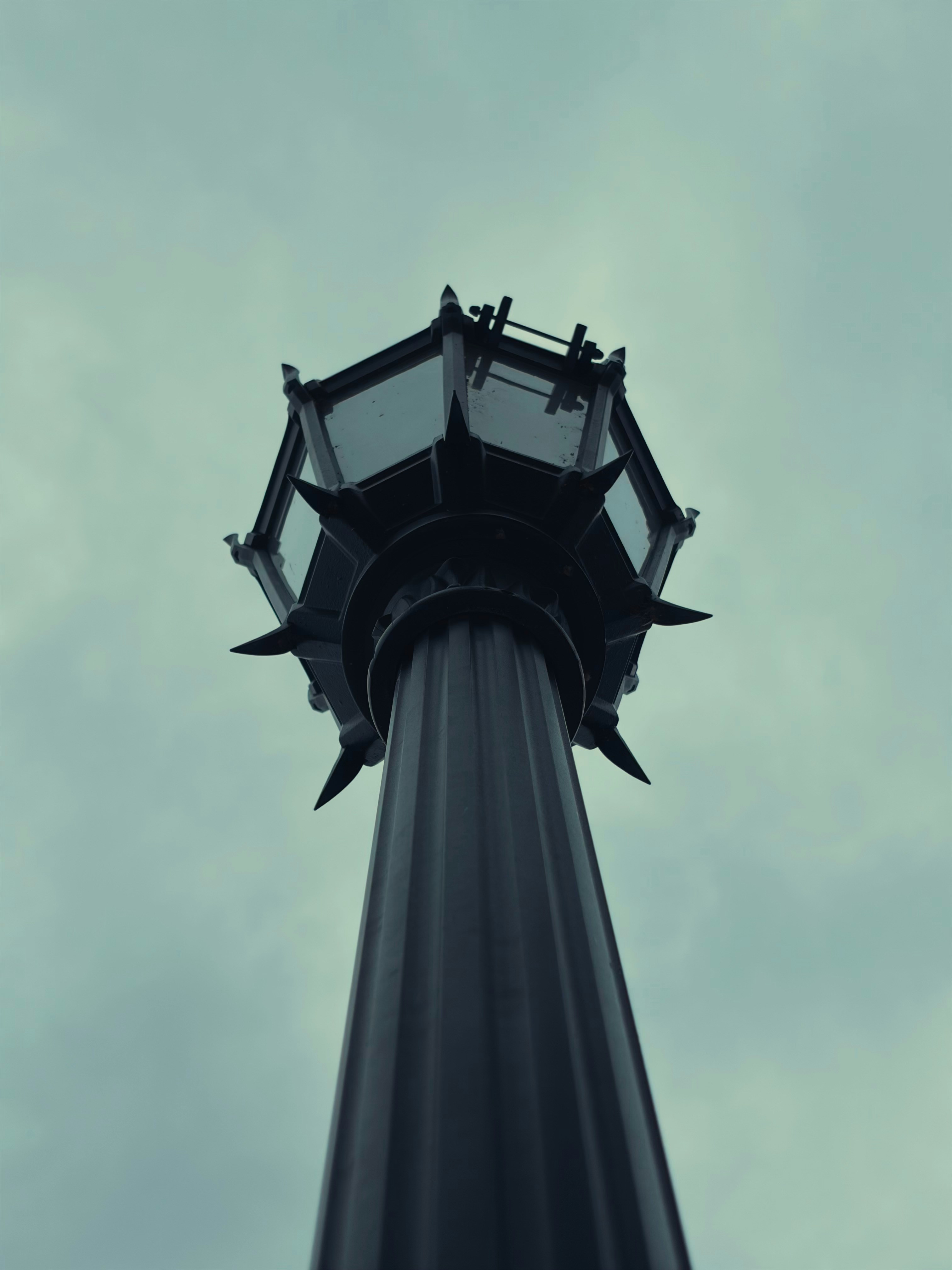 Towering Illumination: A Low-Angle Look Up at a Modern Lantern
