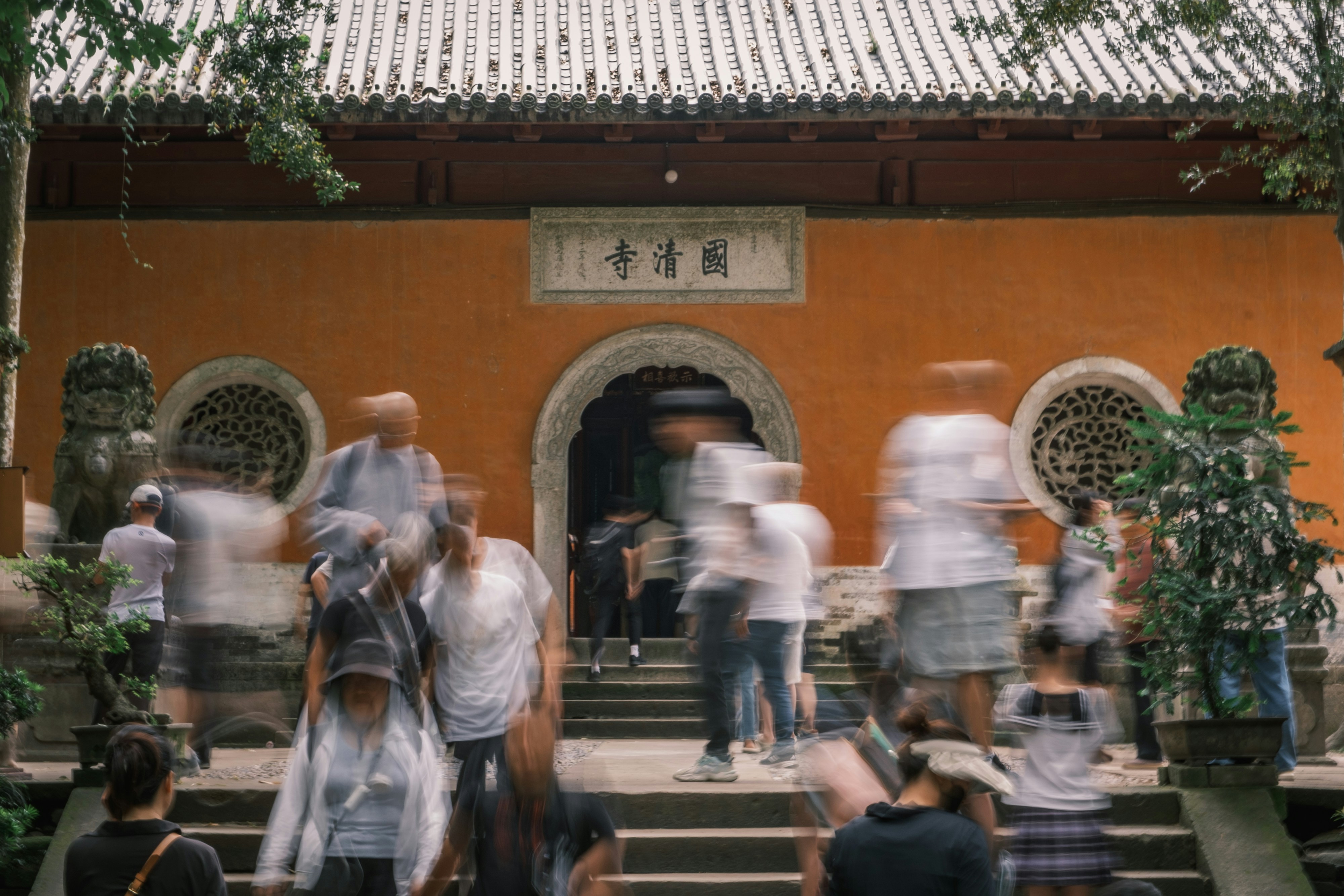 Movement at the Orange Courtyard: Visitors in a Traditional Temple Setting