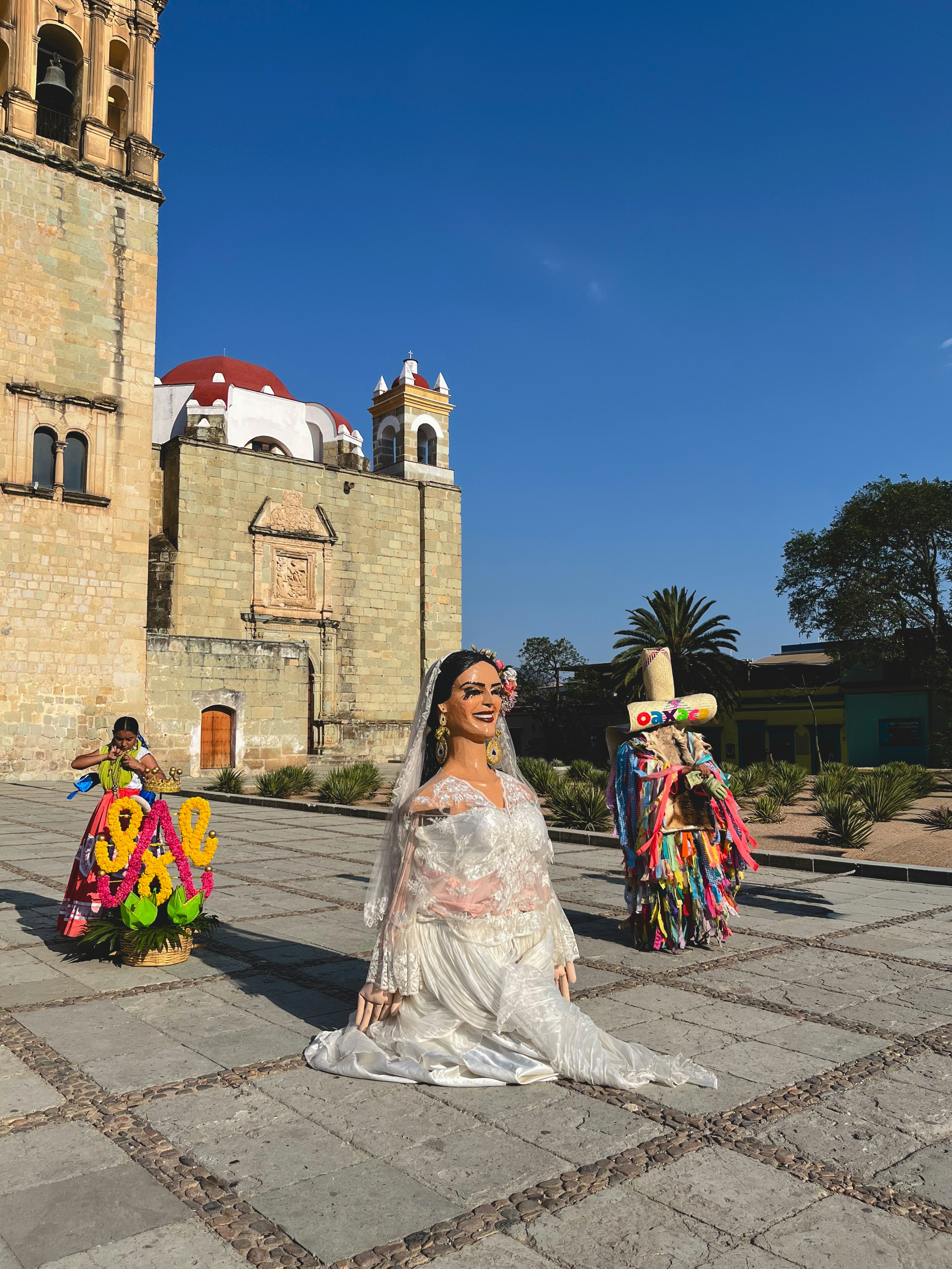 Bride in White: A Dancer's Moment in a Sunny Plaza