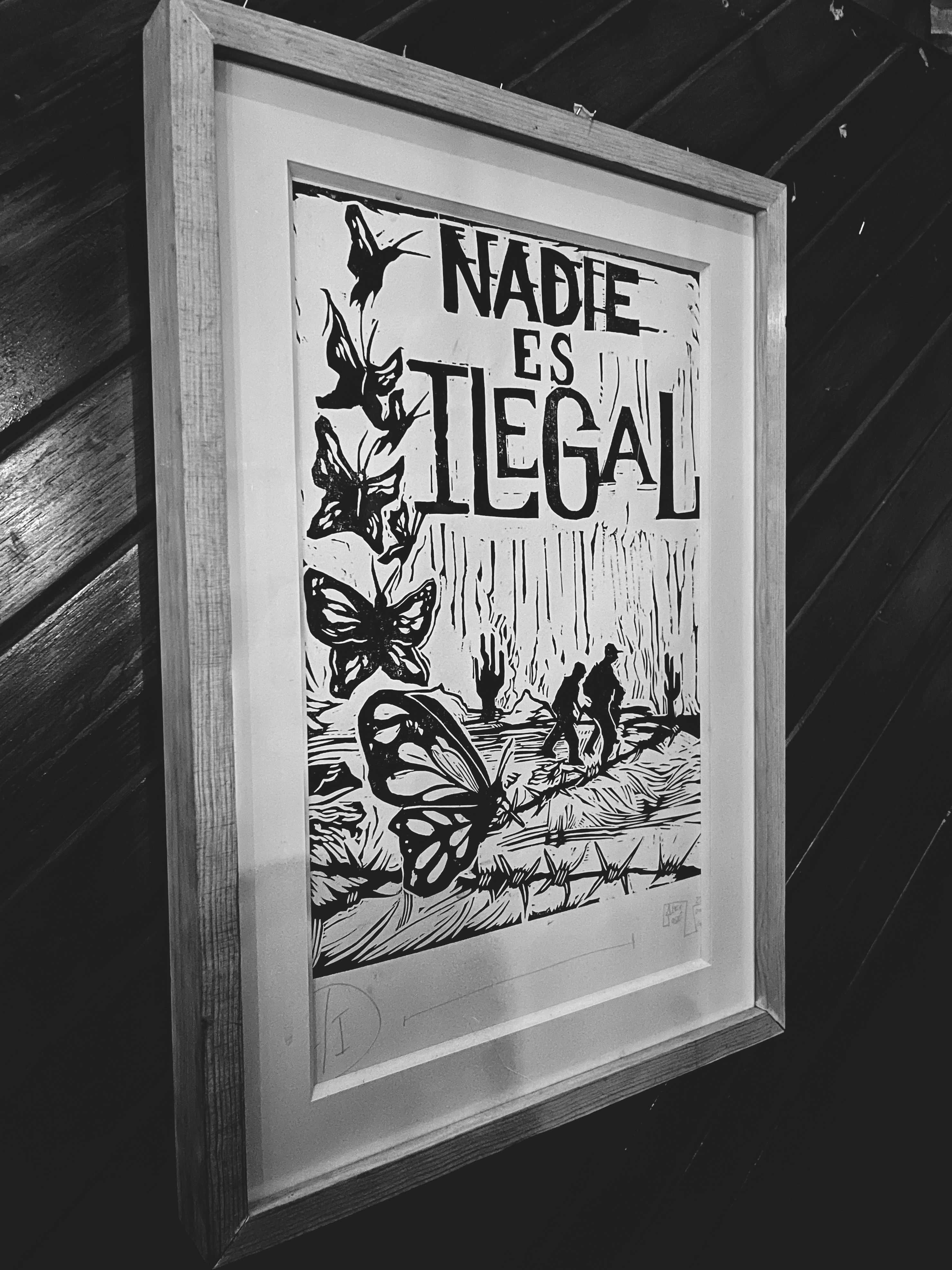 Framed Ink: Butterflies and a Distant Figure Carved in Shadow