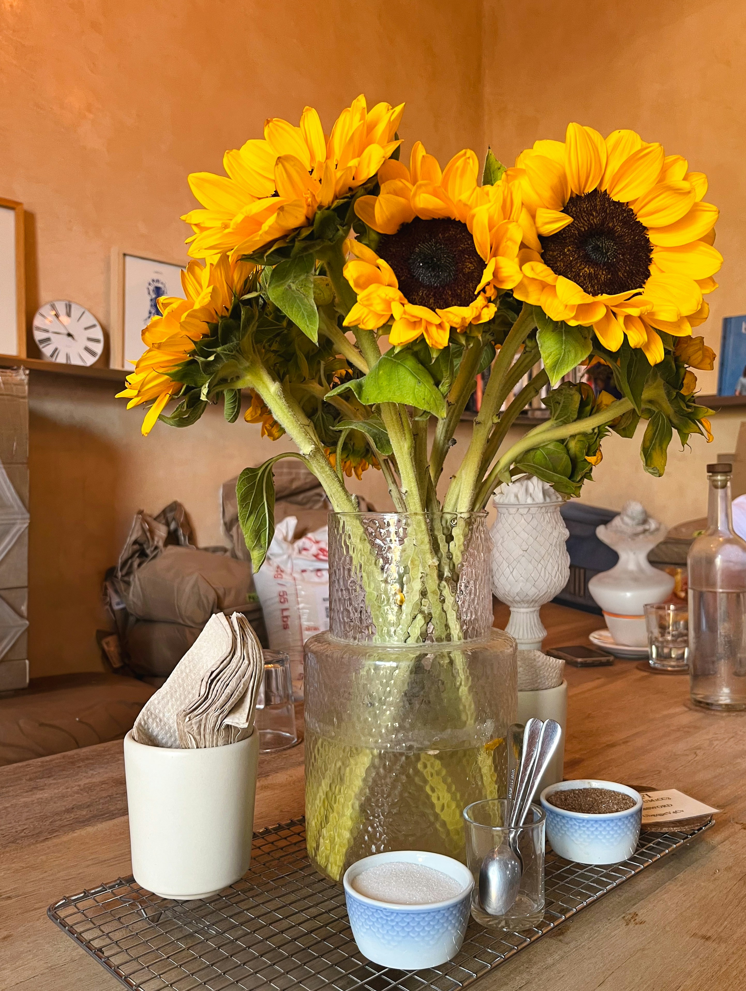 Sunlit Sunflowers in a Rustic Vase Banner a Cozy Table Scene