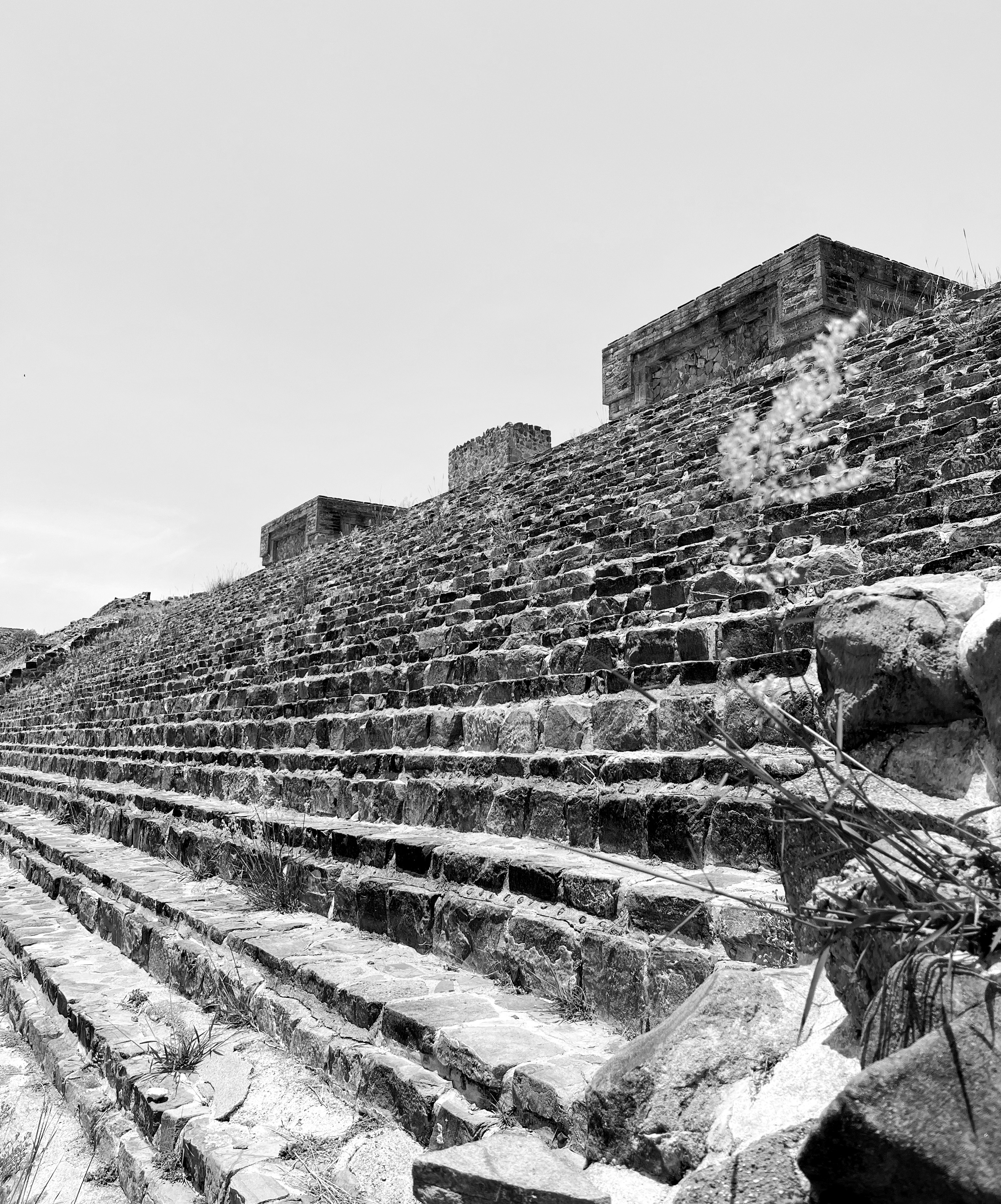 Ancient stone pyramid steps in black and white.
