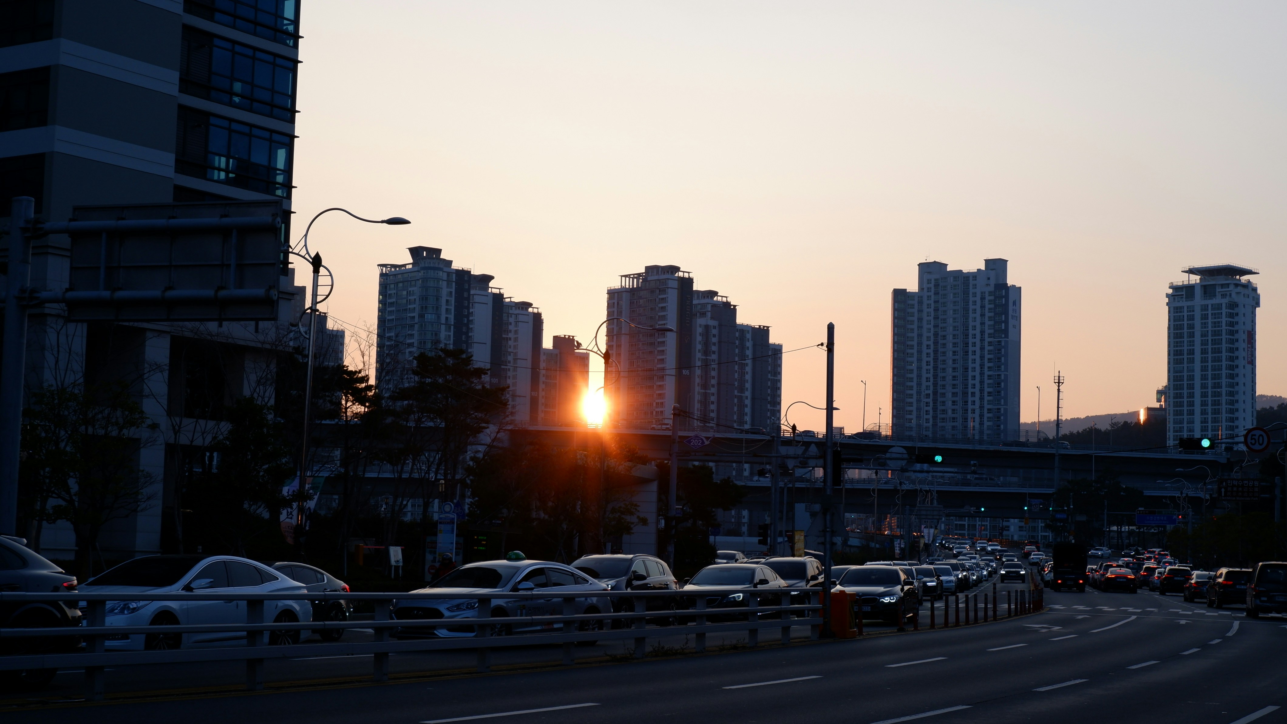 Sunlit Skyline Through a Street Corridor