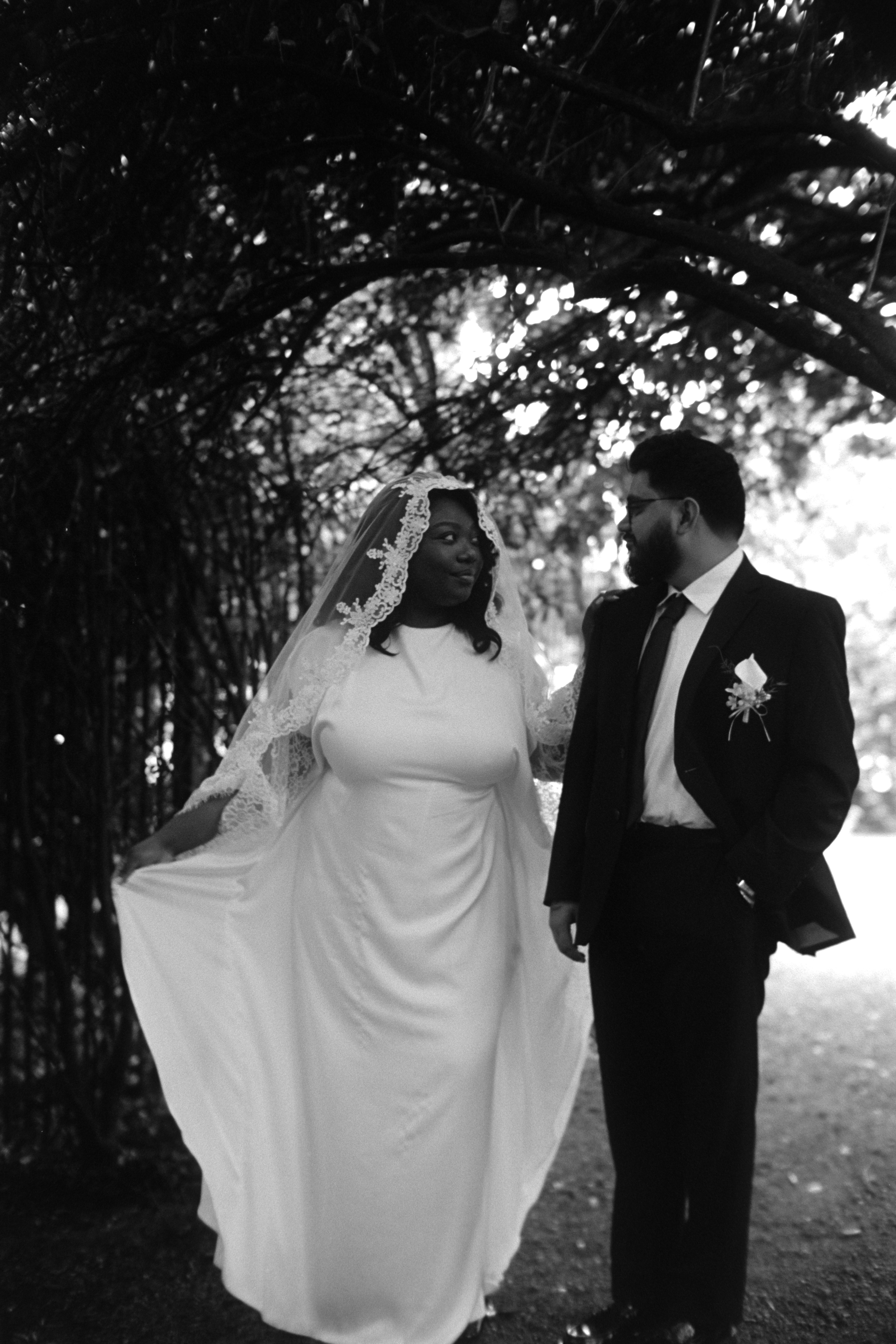 Veil and Vows Under a Shaded Arc