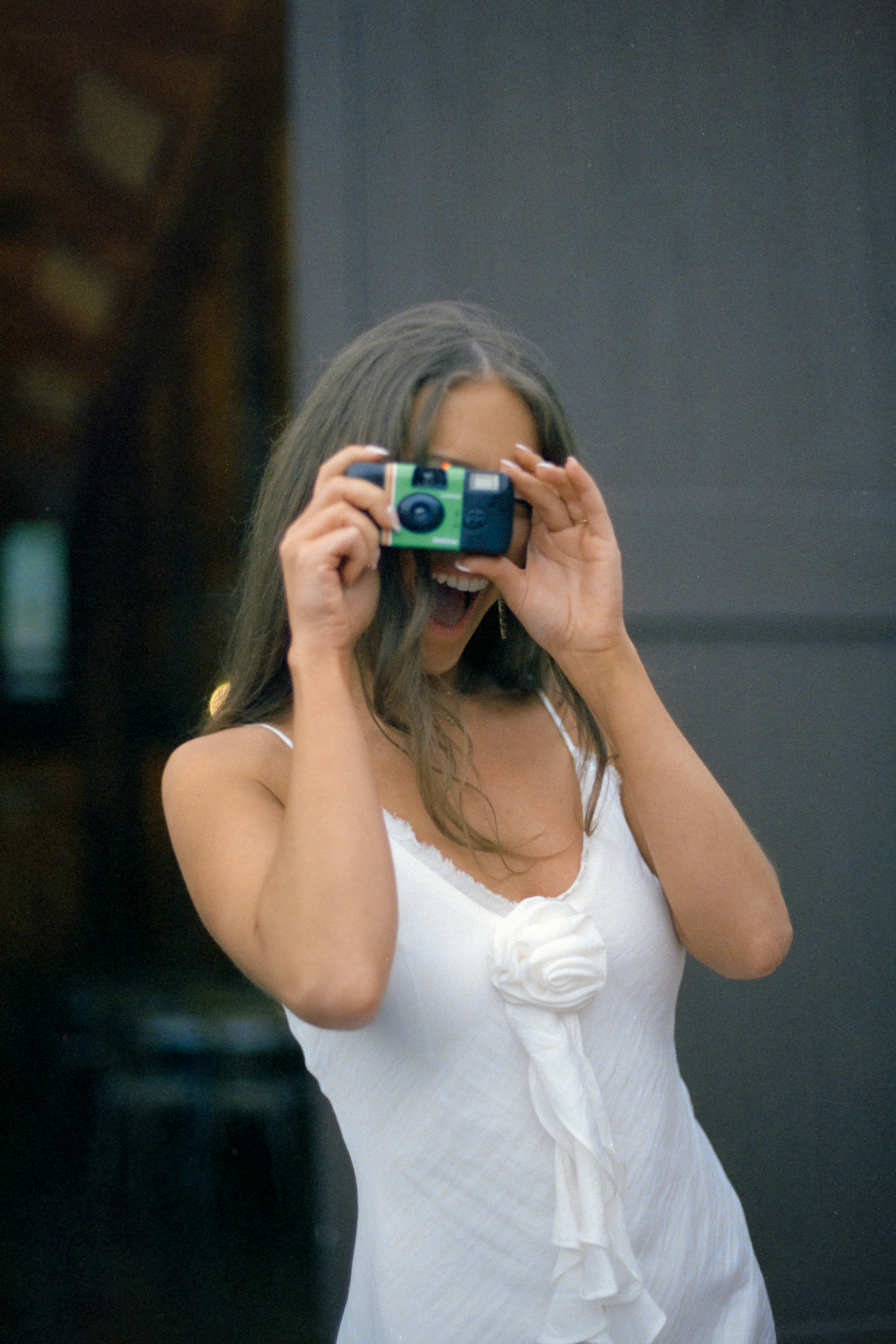 Flip of a Moment: A candid shot with a retro-style cam held up