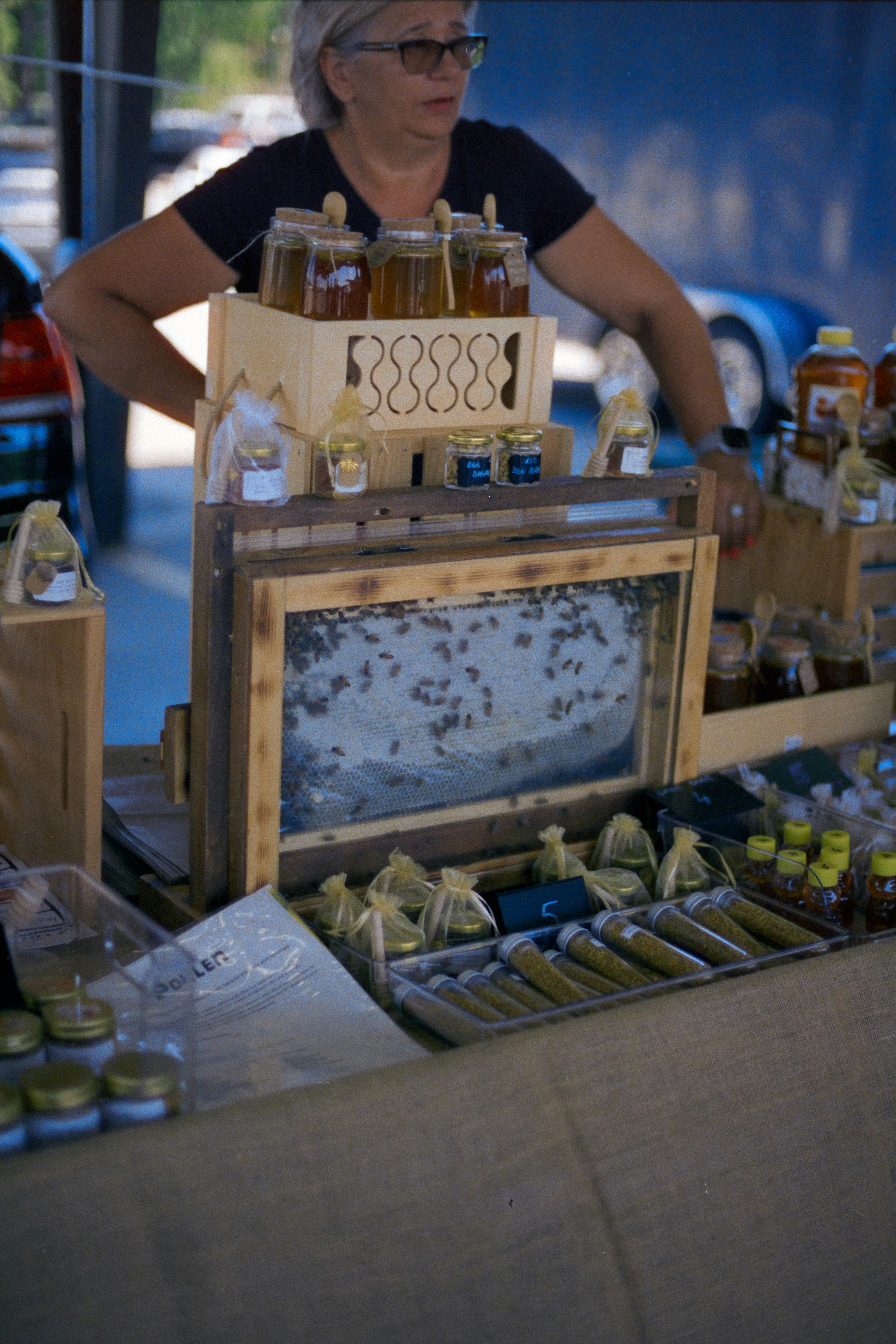 Honey Jar Market Stand: Bees, Bottles, and a Wooden Frame