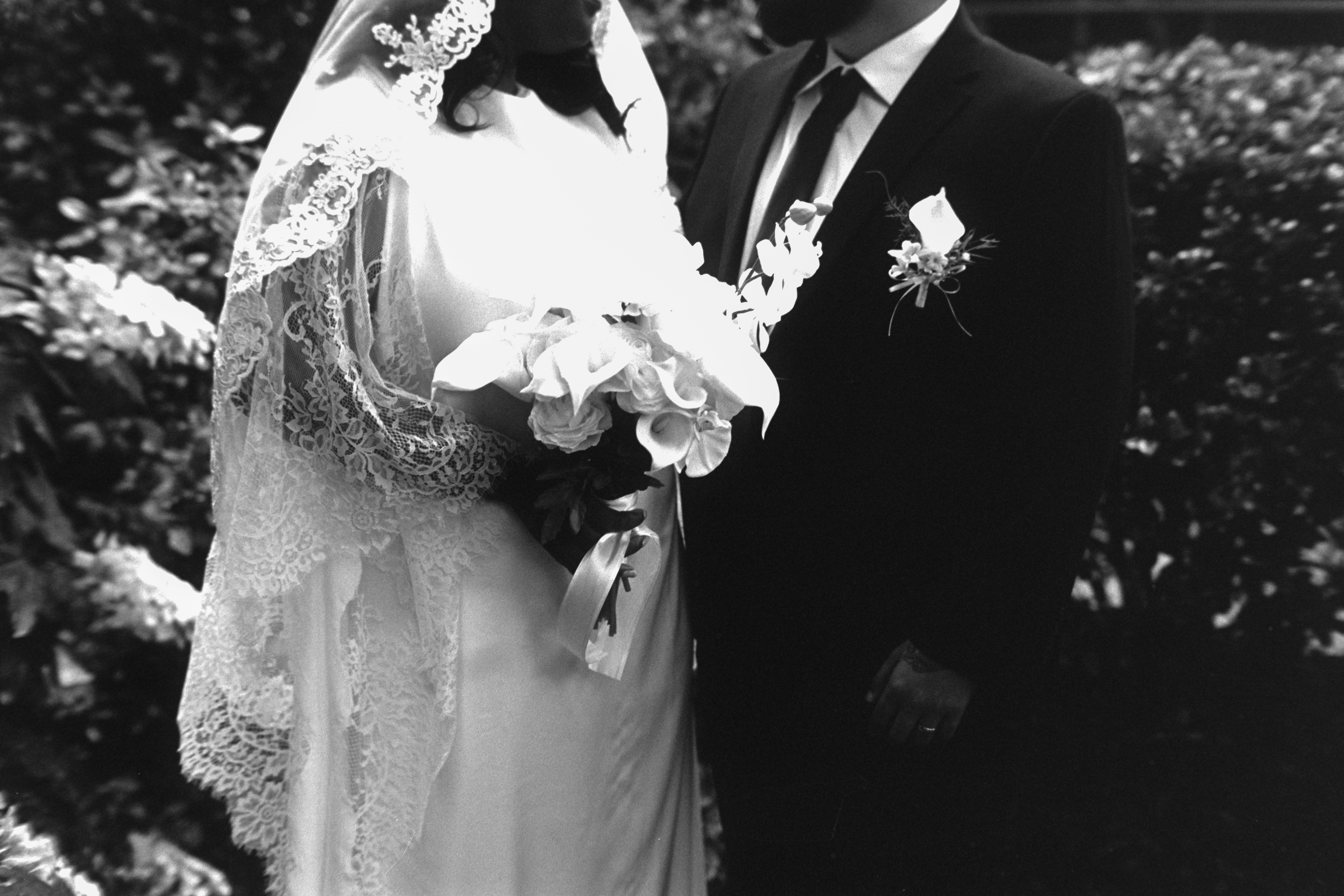 Bridal Veil and Gown in Quiet Garden Moment