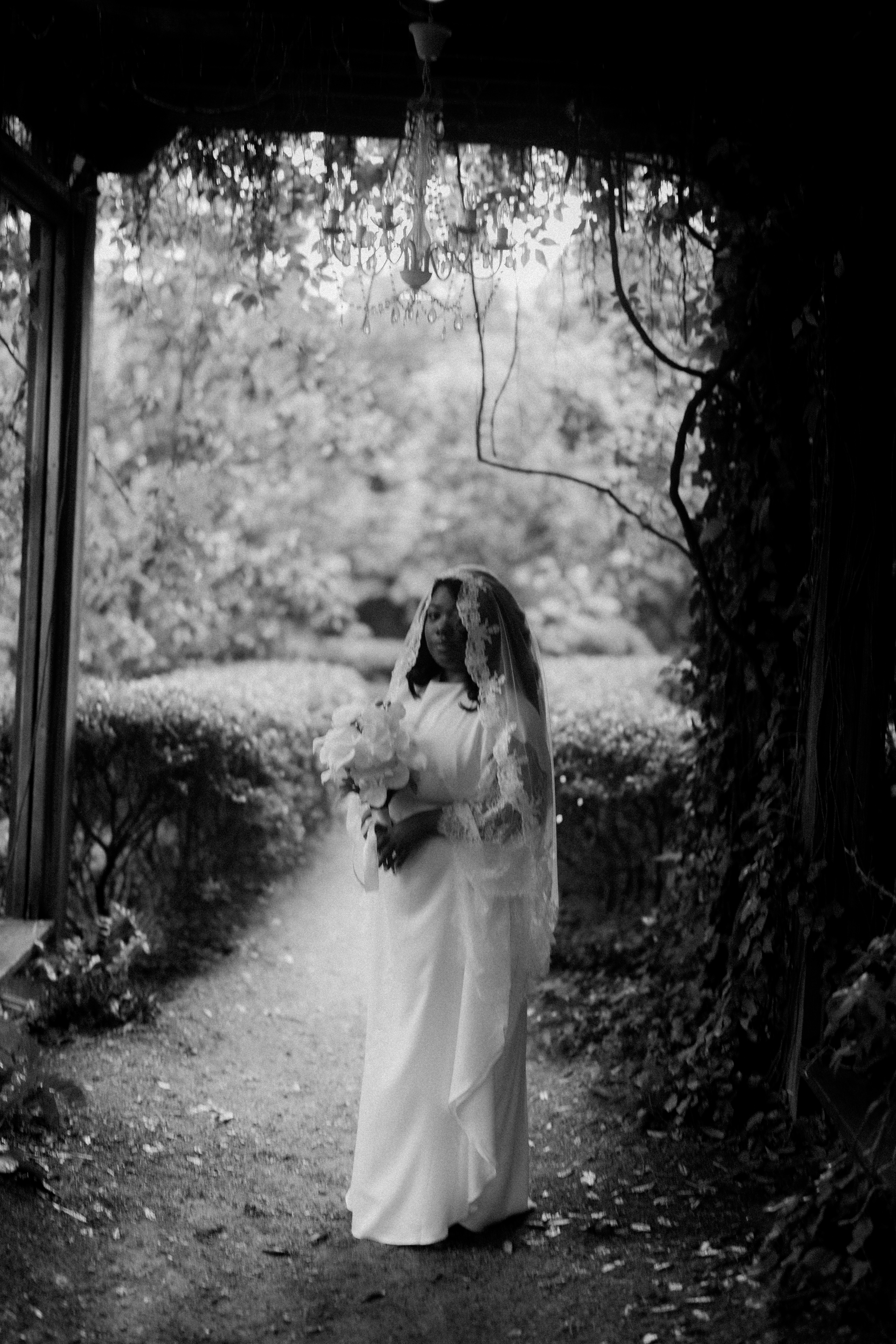 Veiled Bride in the Garden Tunnel