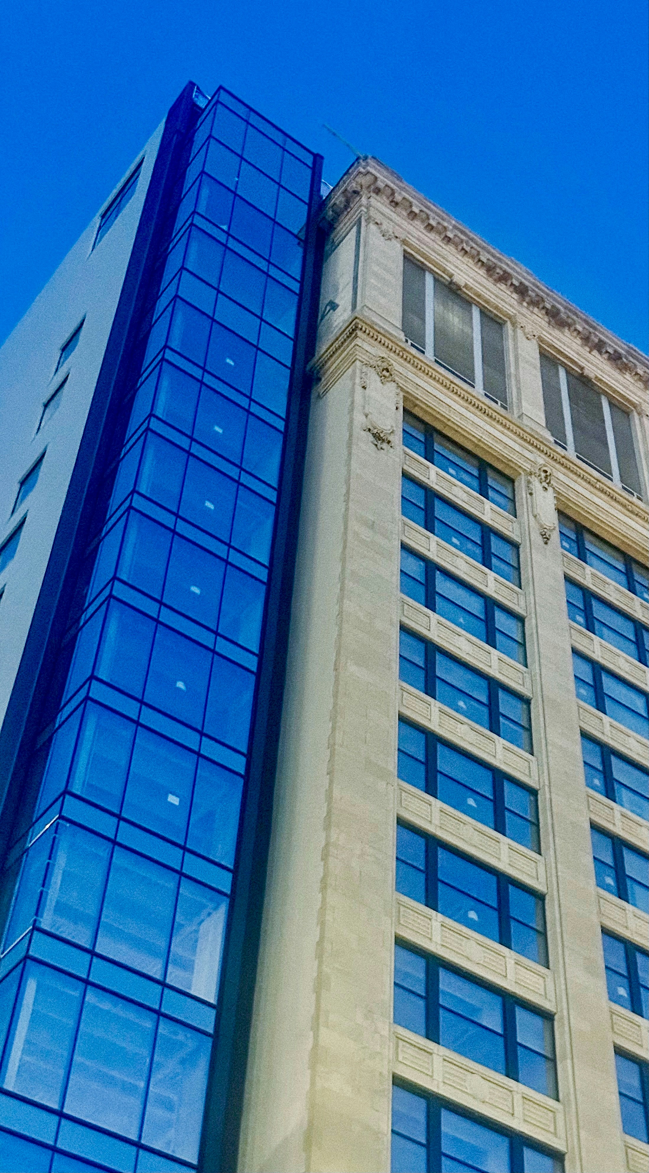 Vertical Synergy: Glass Curtain and Historic Facade Meet