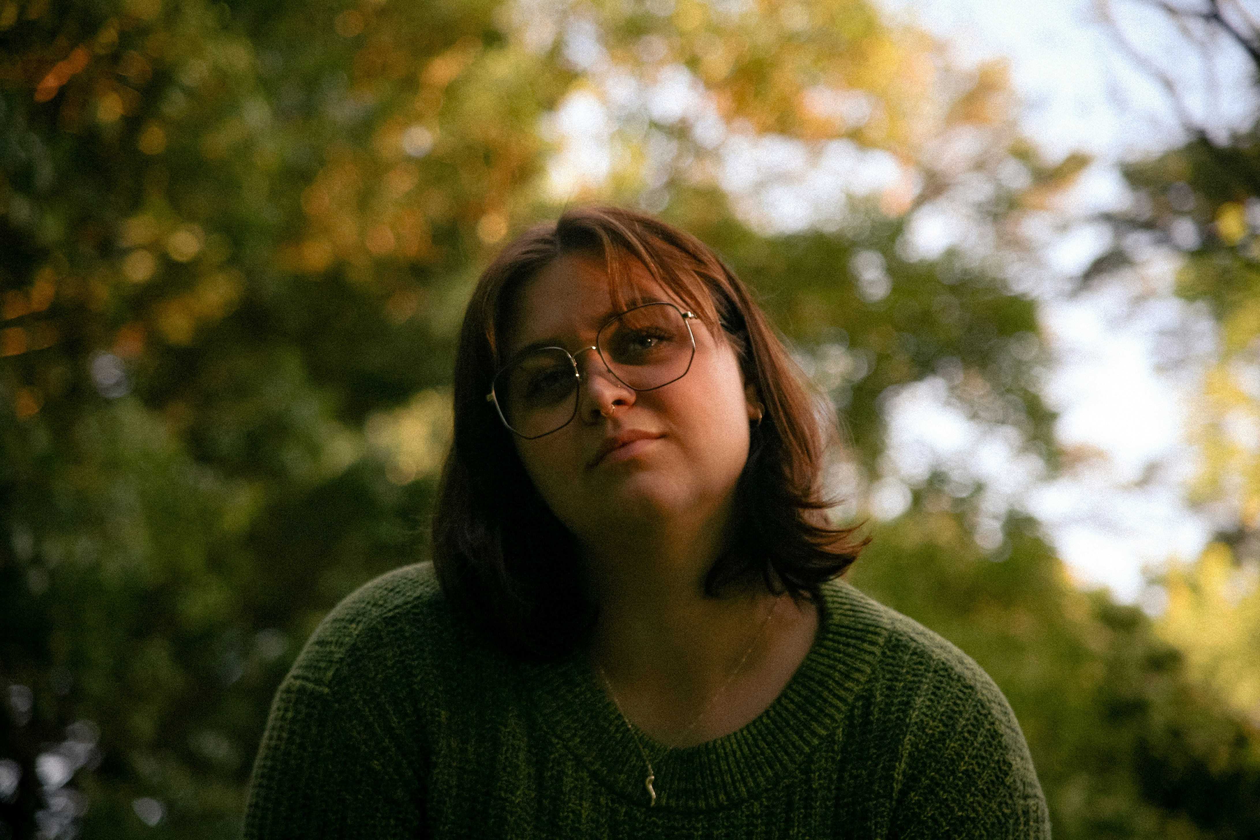 Muted Green Portrait Under Autumn Canopy