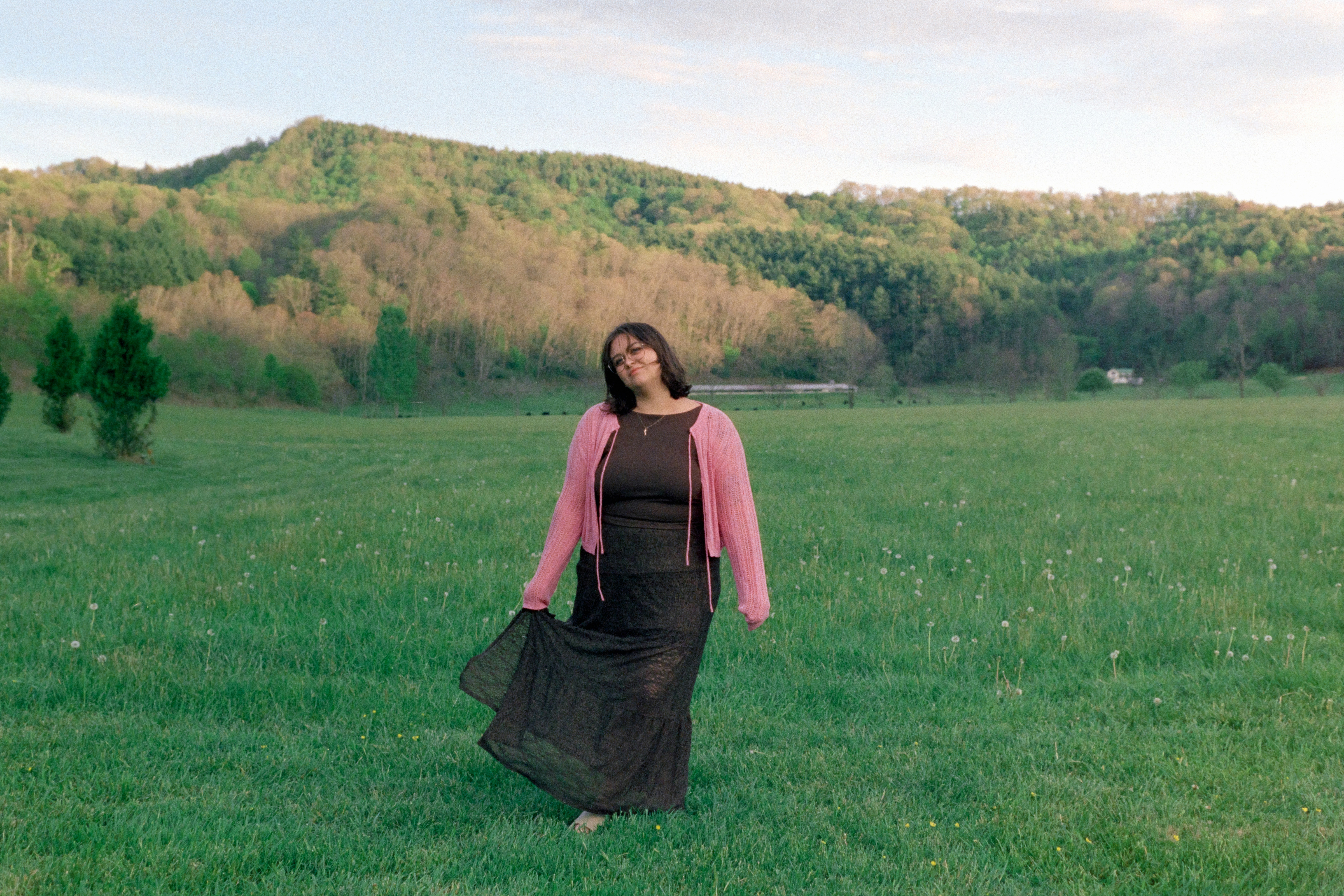 Portrait in a Meadow: A Woman in Pink at Dusk