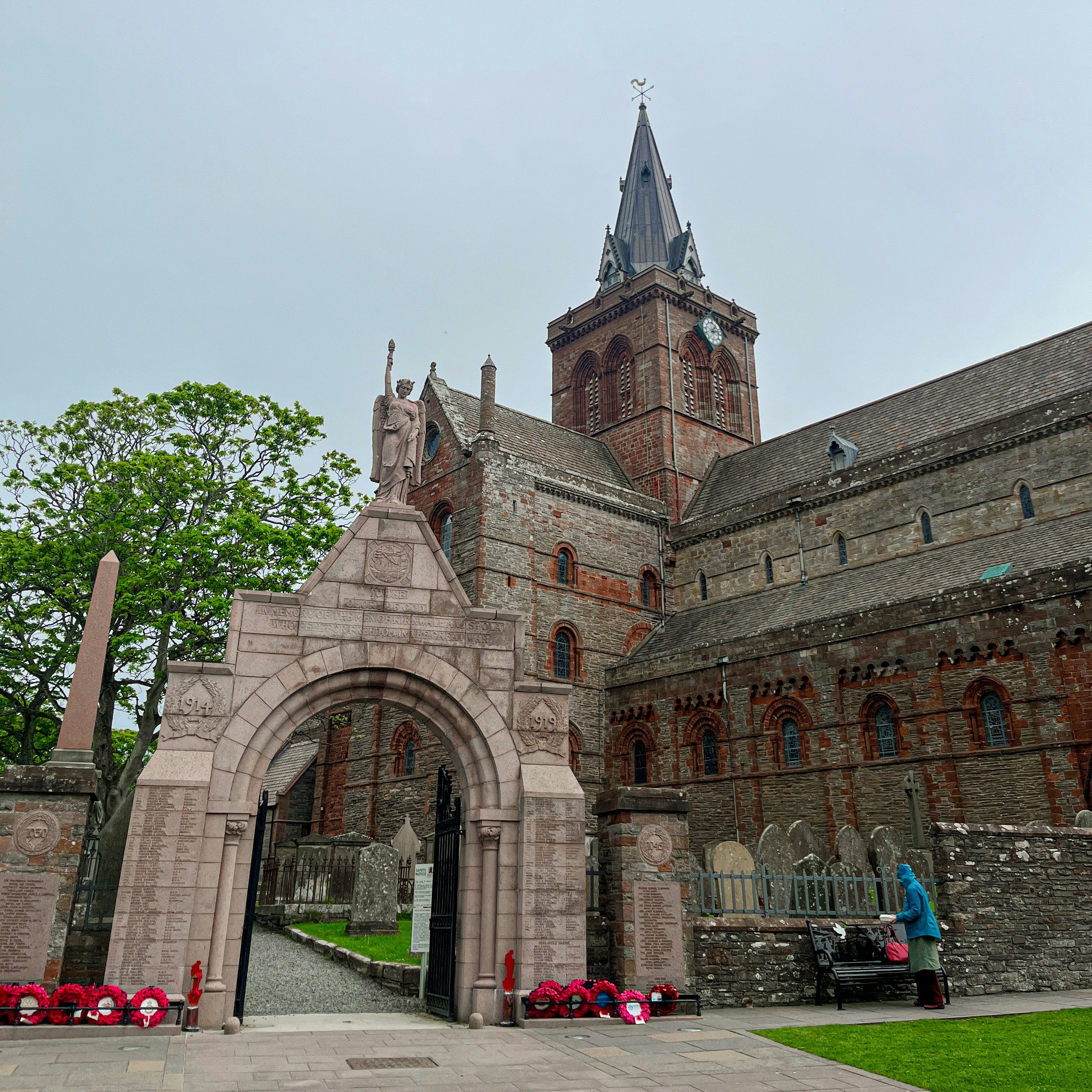 Gothic Gateway to the Abbey: Stone Arch Under a Clock Tower