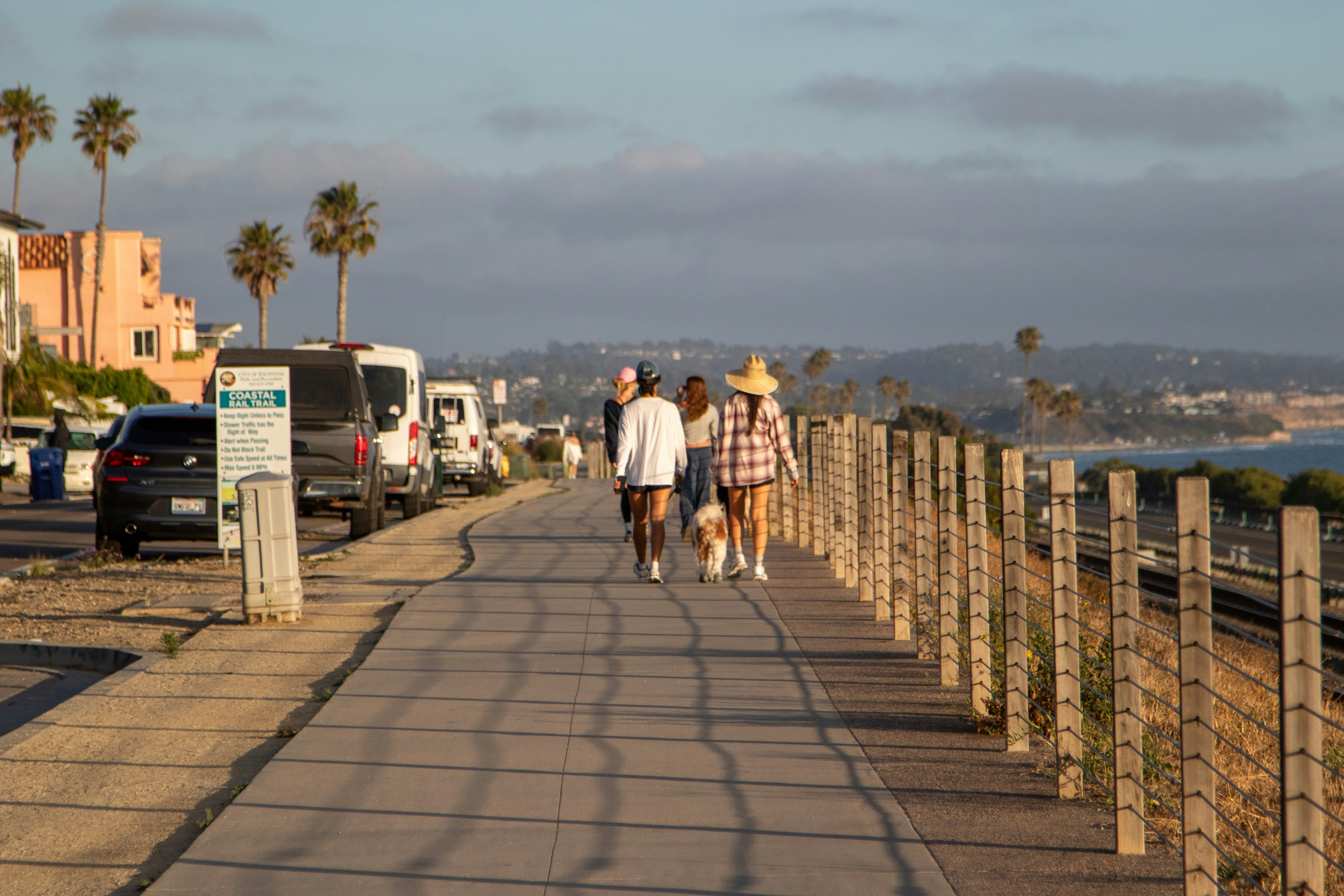 Coastal Promenade Stroll: A Sunlit Path Beside the Sea