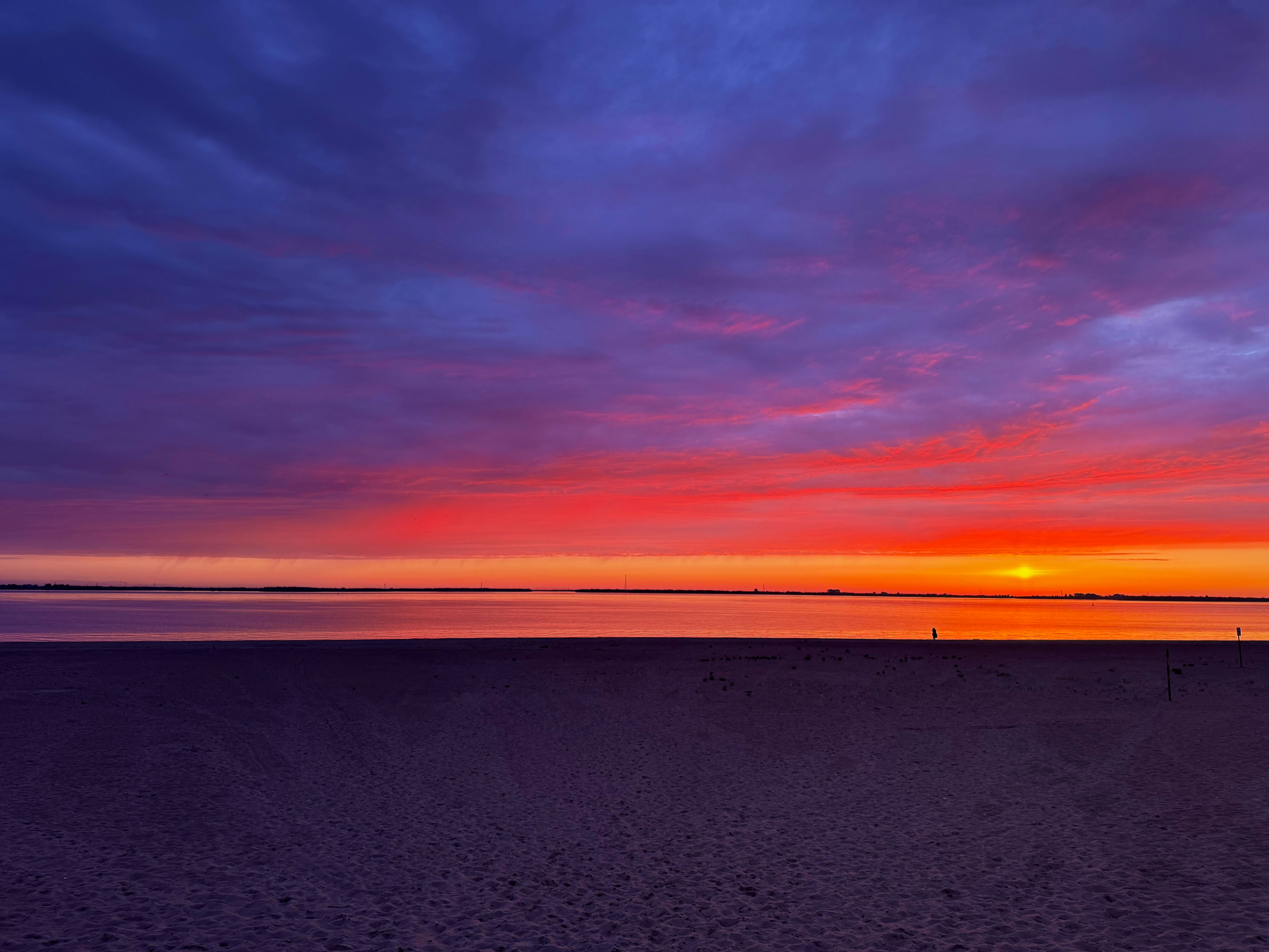 Crimson Horizon Over Quiet Tidal Sand