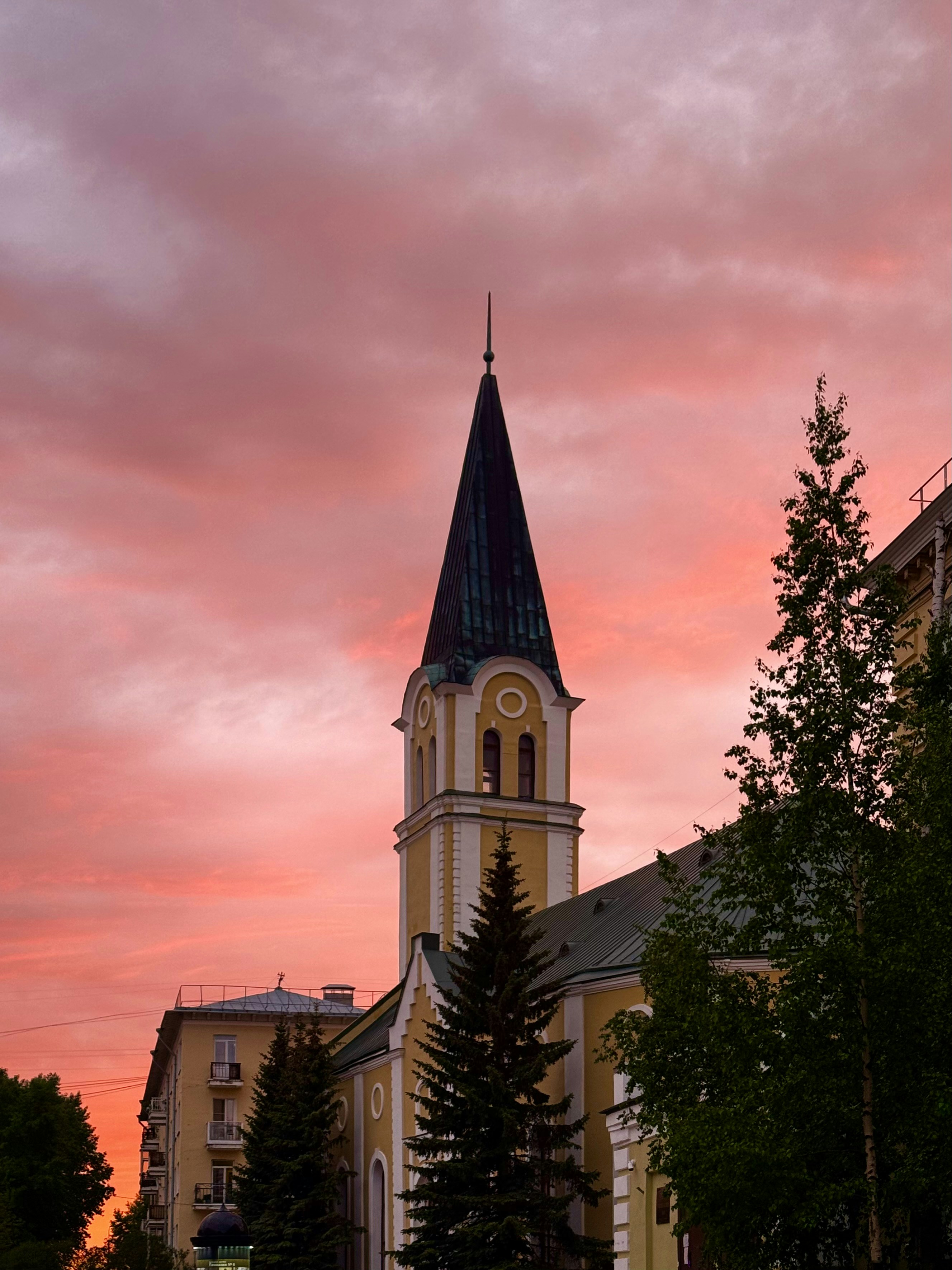 Sunset Spire: A church steeple against a rosy sky