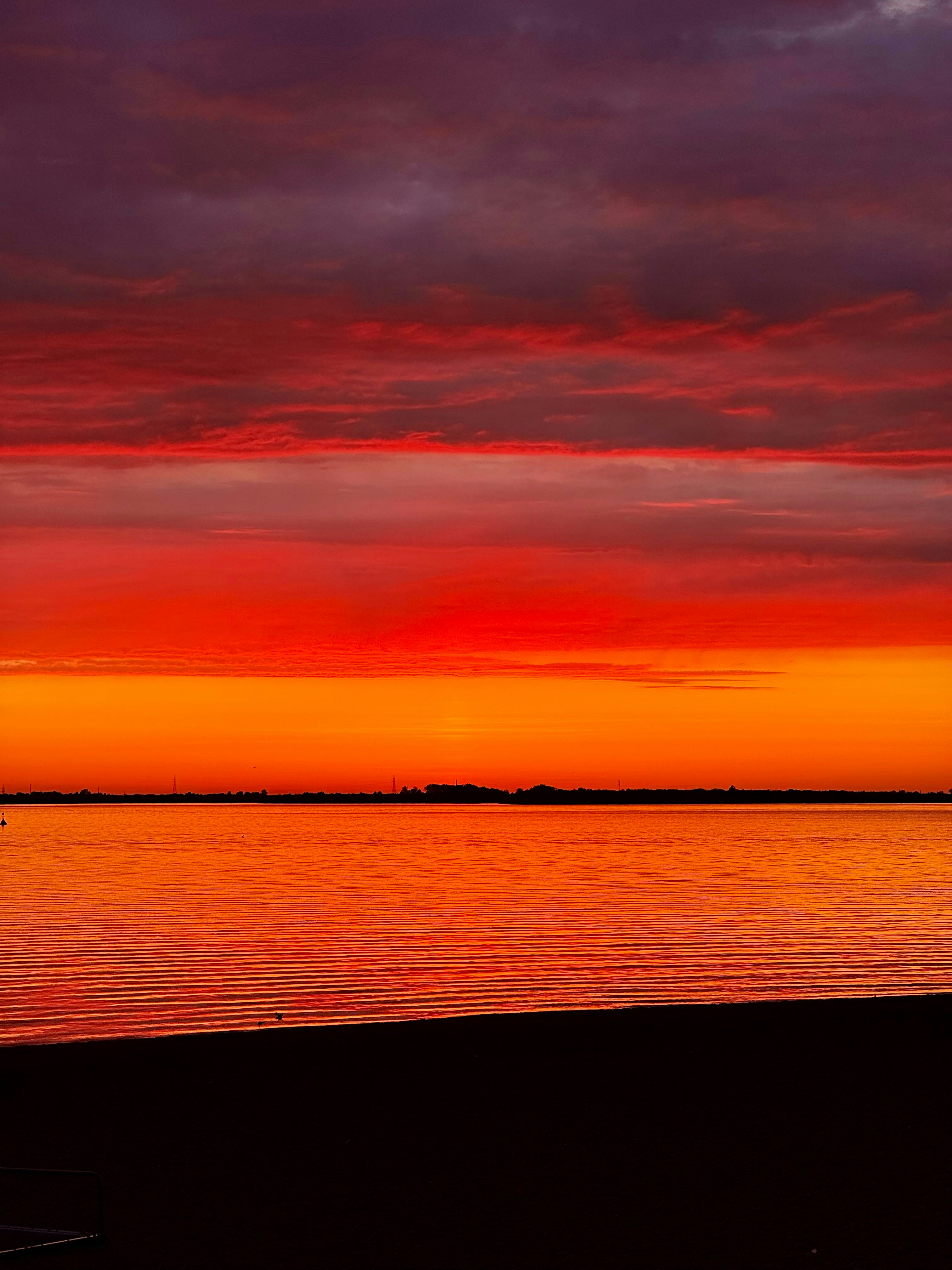 Crimson Horizon Over Quiet Waters